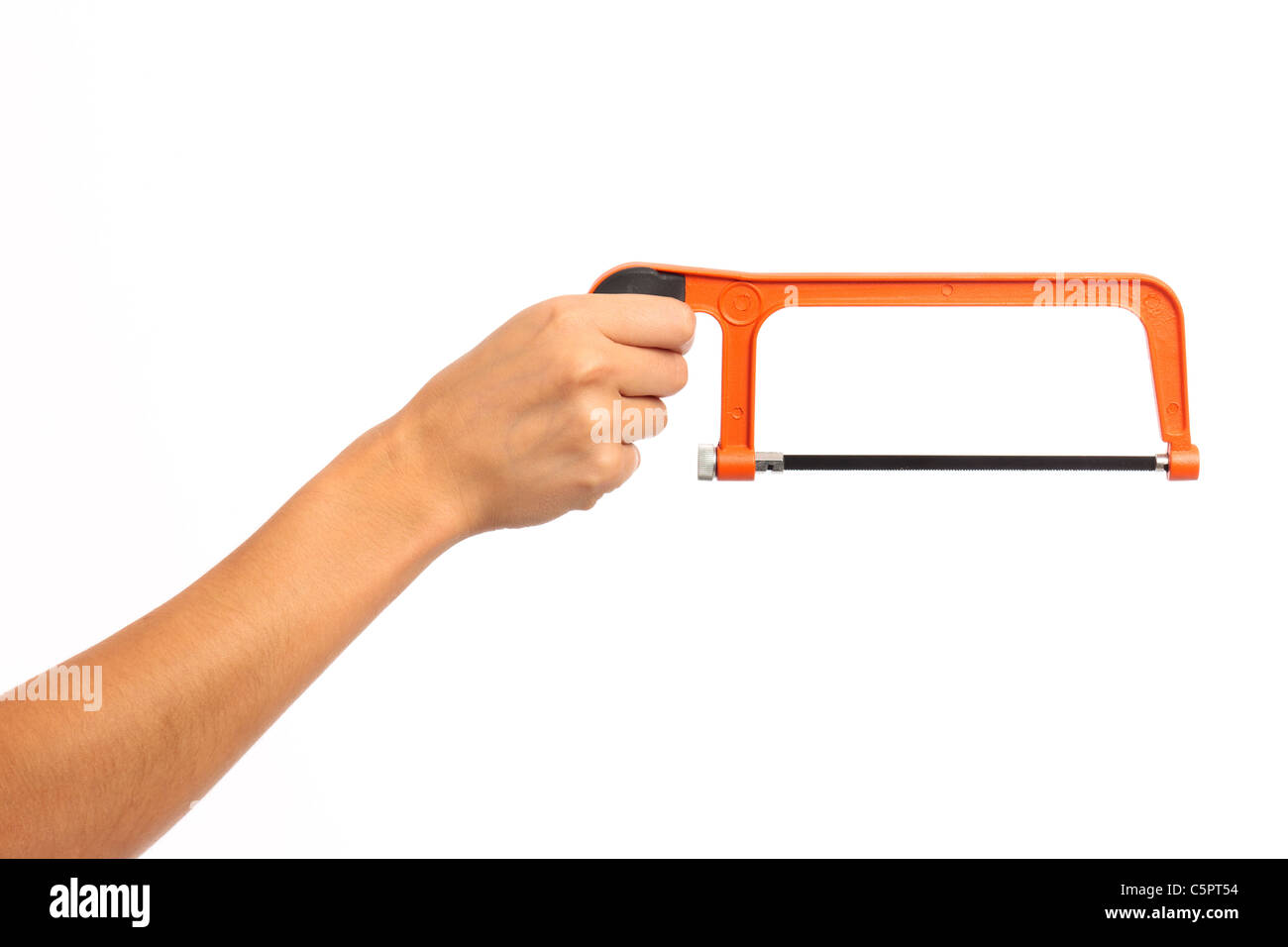 A female hand holding an orange hack saw on white isolated background ...