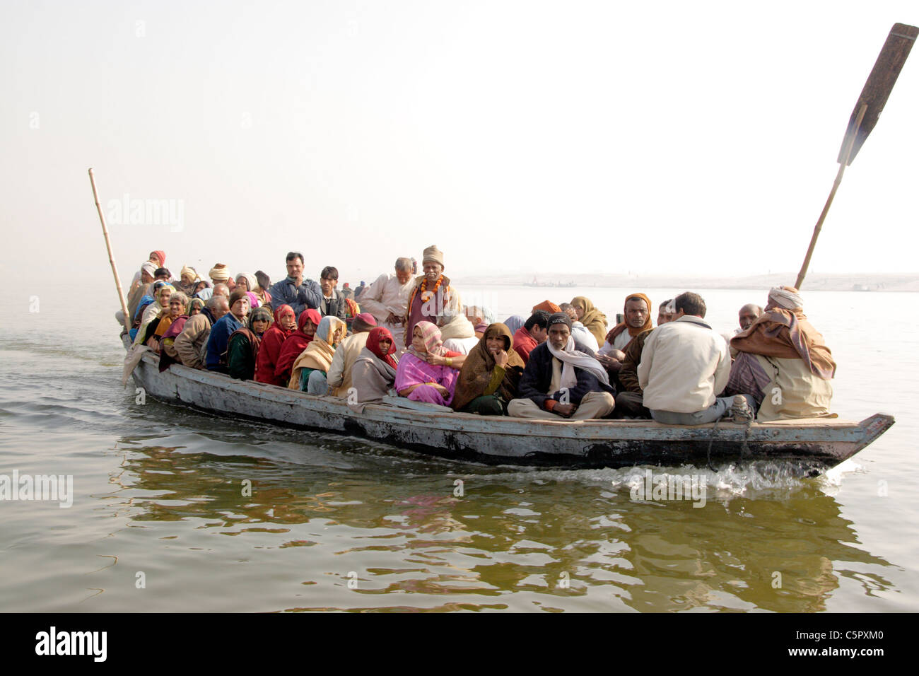 Boat with people on Ganges (Ganga), Varanasi (Benares, Benaras, Banaras ...