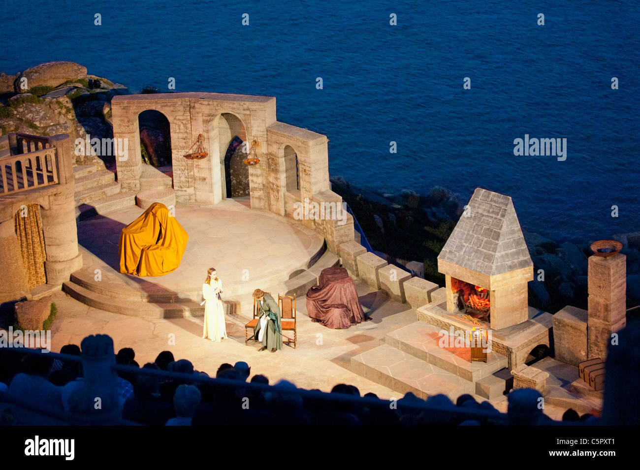 Actresses perform before an audience during a play at the Minack ...