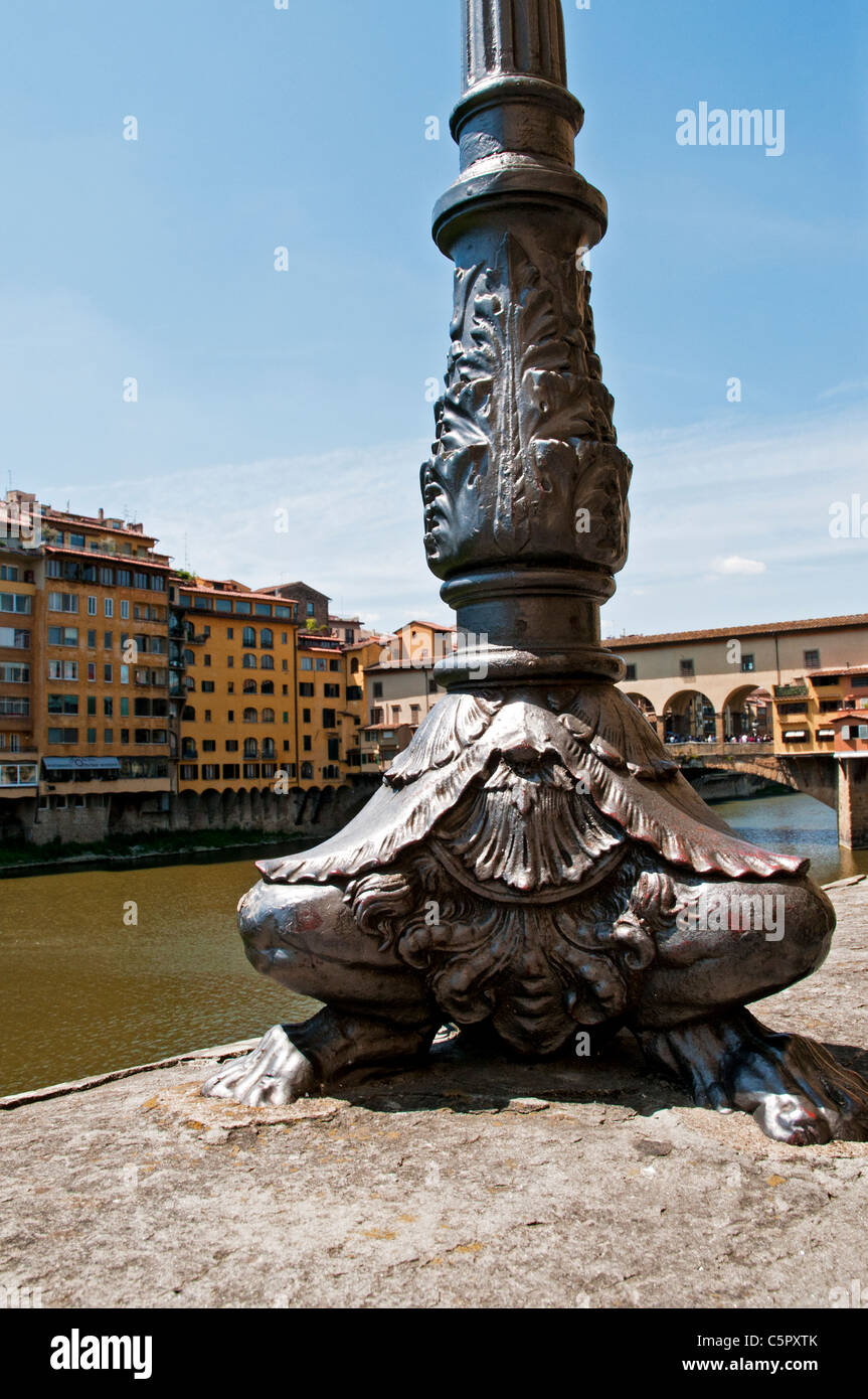 An unusual sculpted lamppost base of a mythical beast with legs and ...