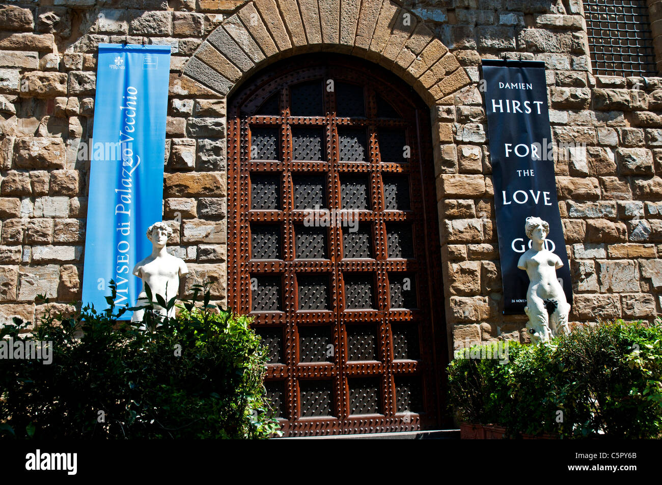 Two statues which at one time held chains across the door stand at the ...