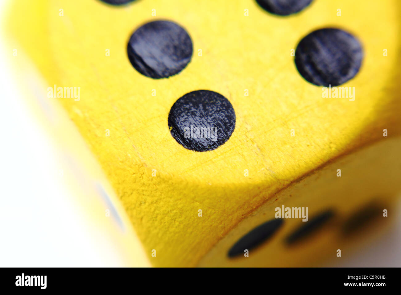 a yellow die close up with the six on top , conceptual image , metaphor ...