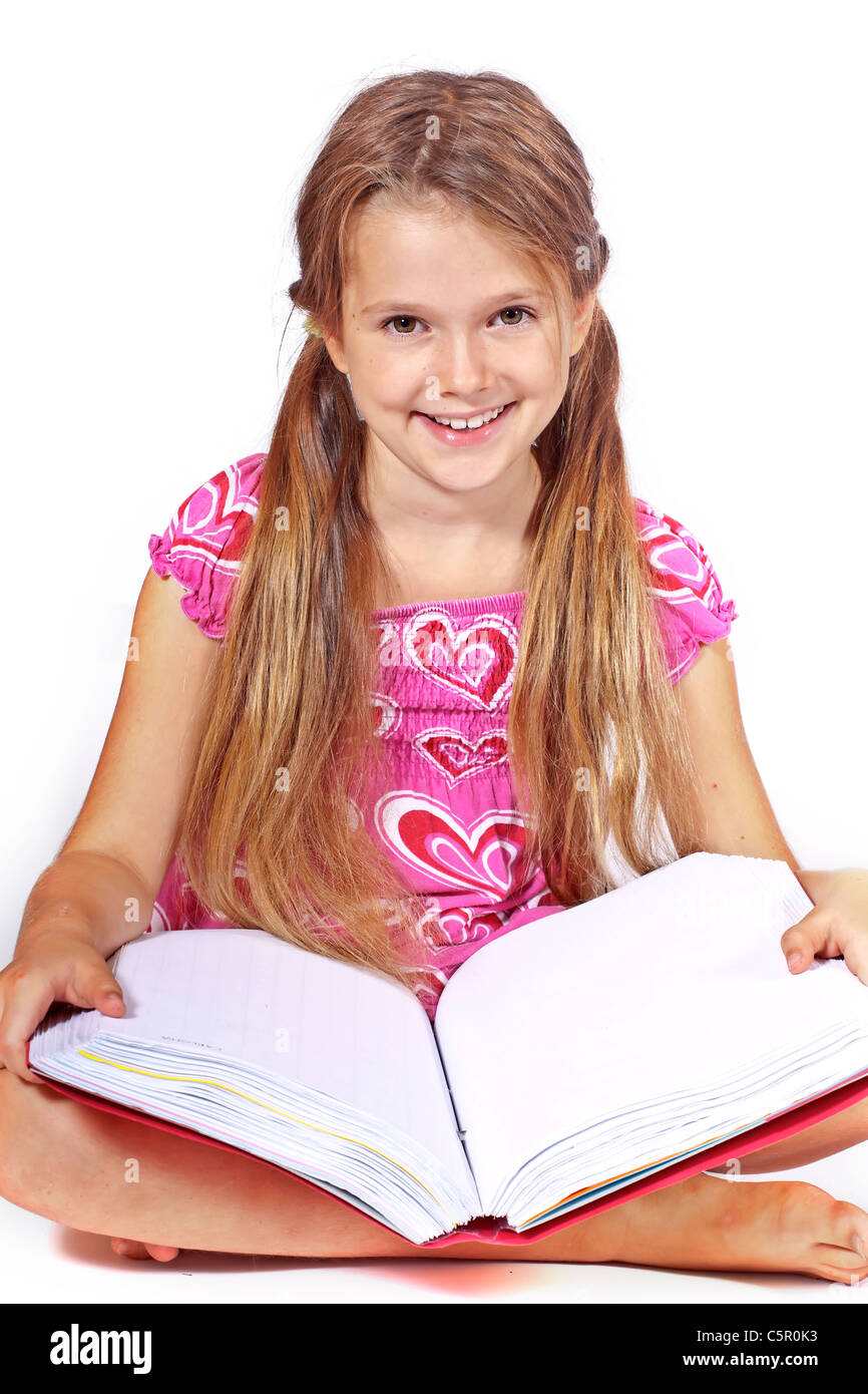 eight year old girl reading a book Stock Photo - Alamy