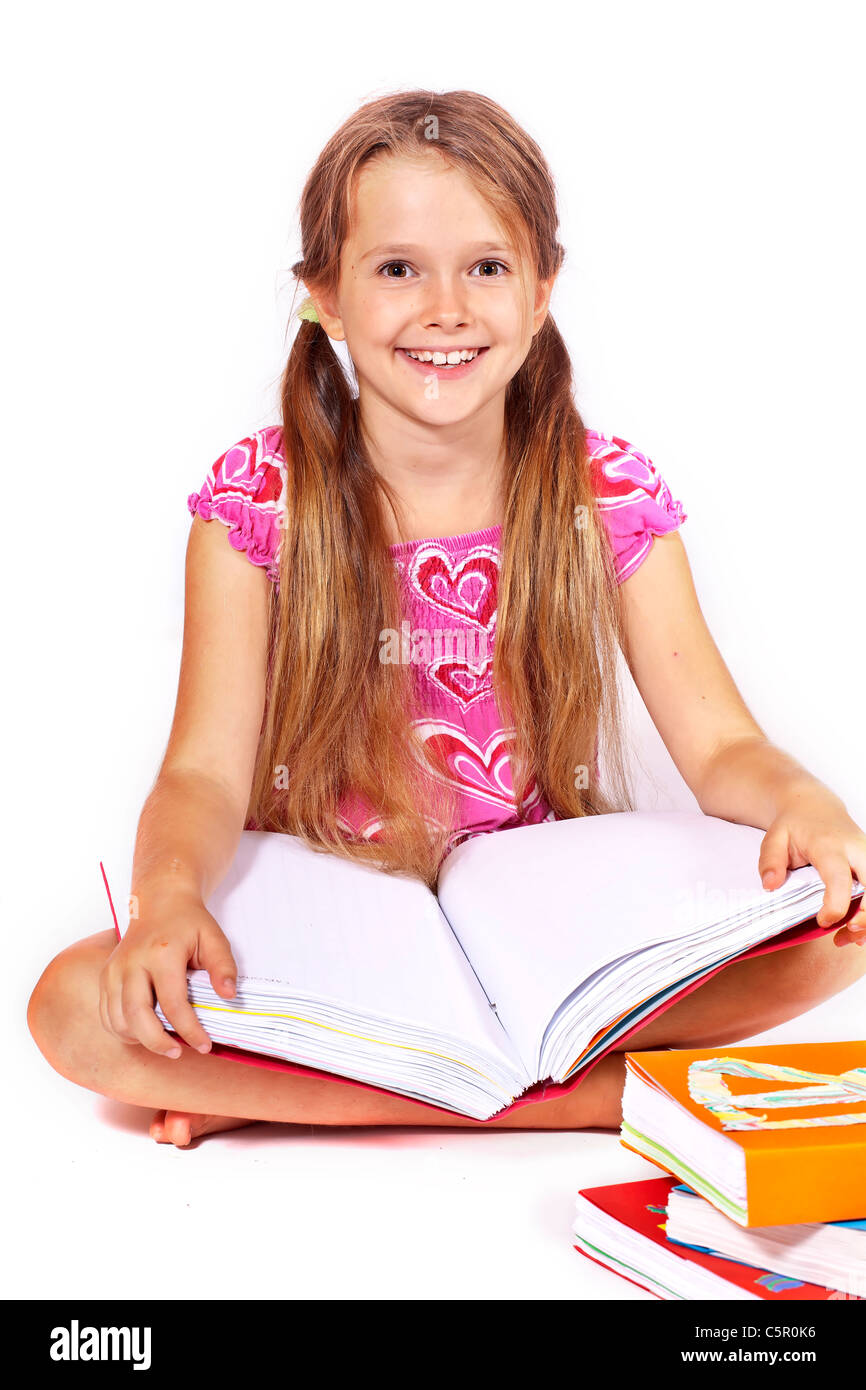eight year old girl reading a book Stock Photo - Alamy