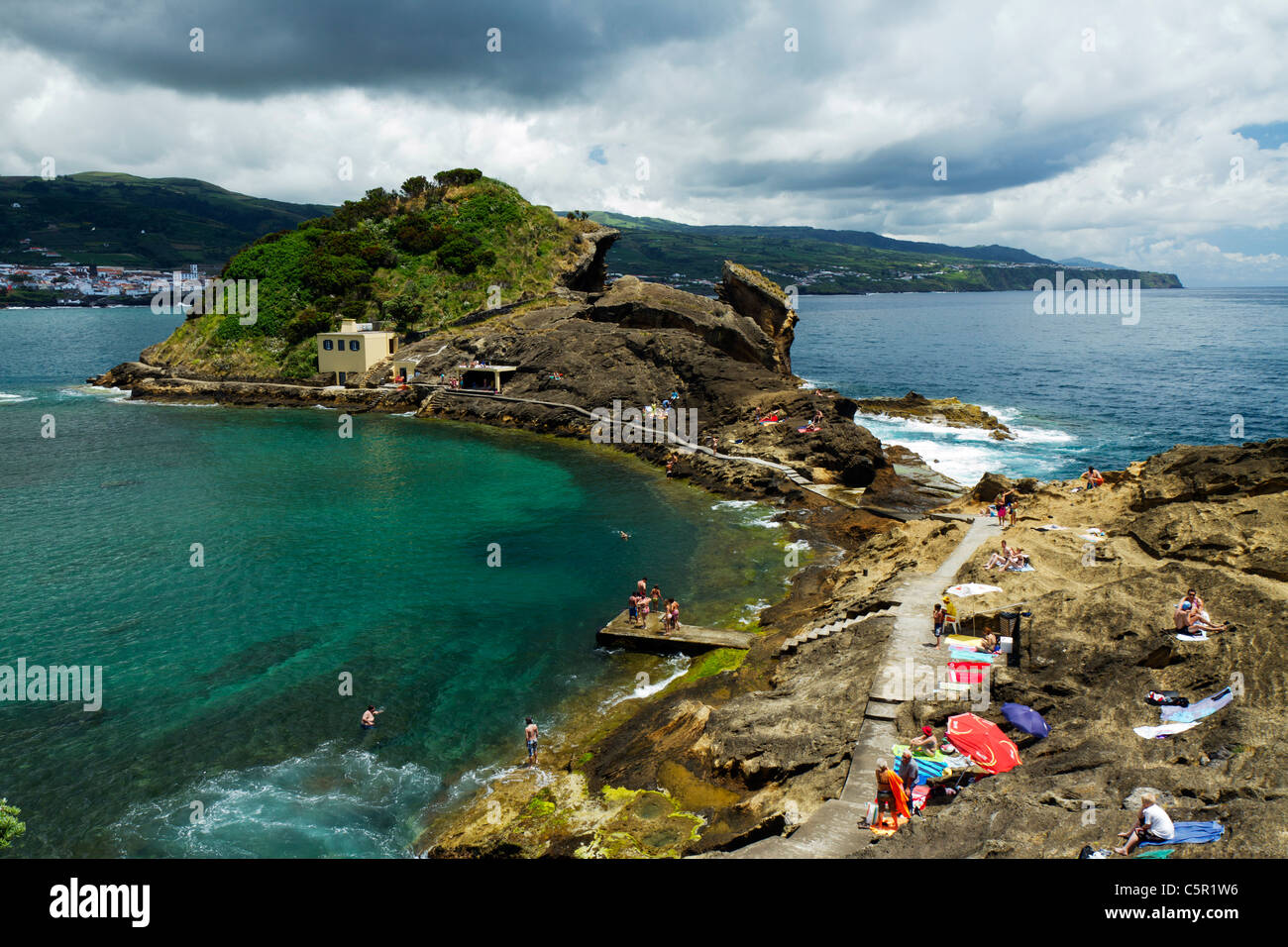 Tourists at Ilhéu Vila Franca, a volcanic crater lagoon islet off the ...