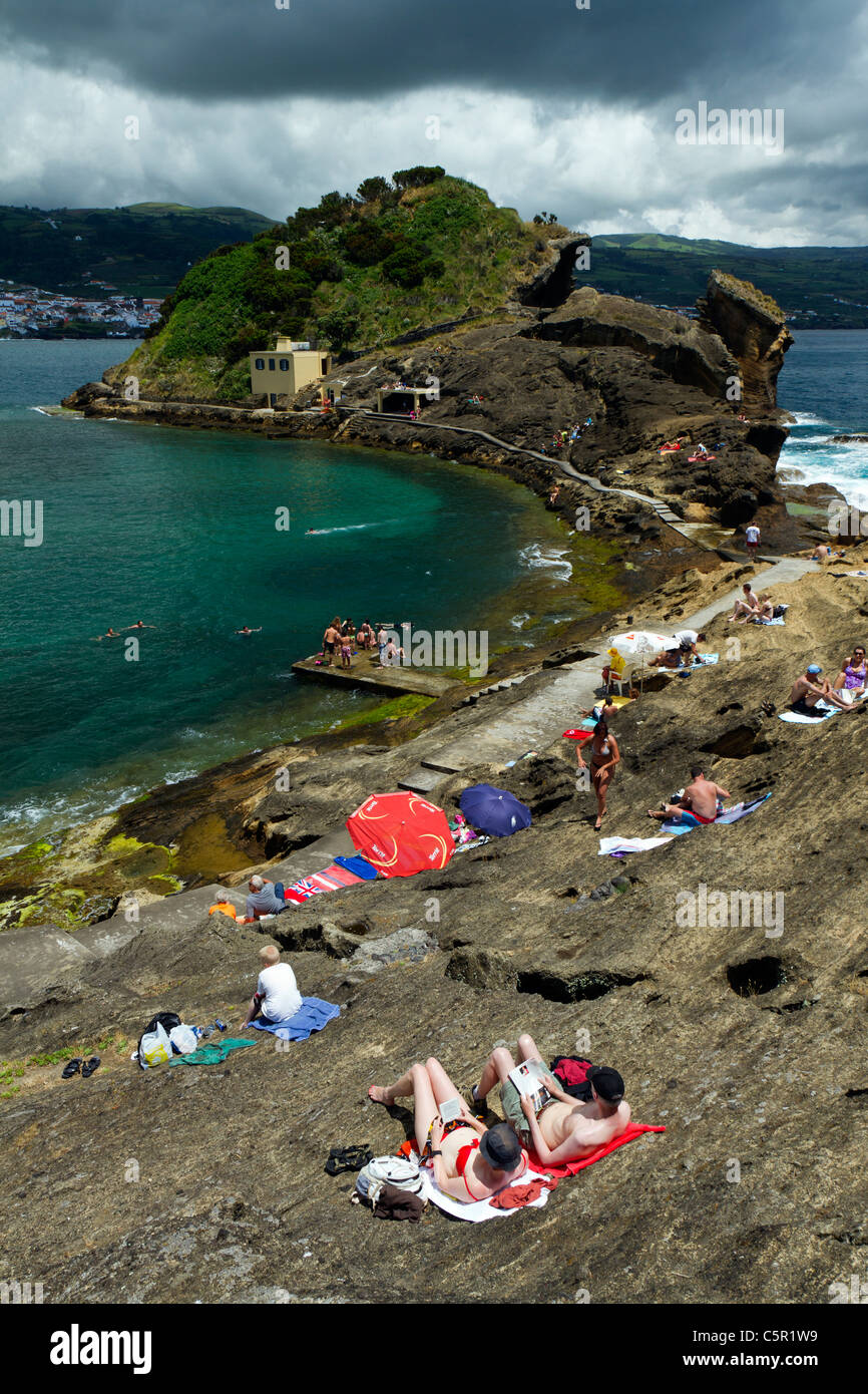 Tourists at Ilhéu Vila Franca, a volcanic crater lagoon islet off the ...