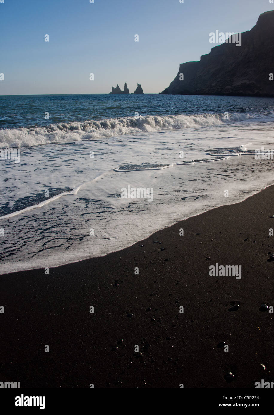 Volcanic beach with surf in sunset, Vik, Iceland Stock Photo - Alamy