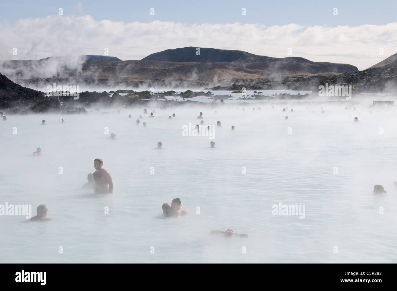 People in mist at The Blue Lagoon, Iceland Stock Photo - Alamy