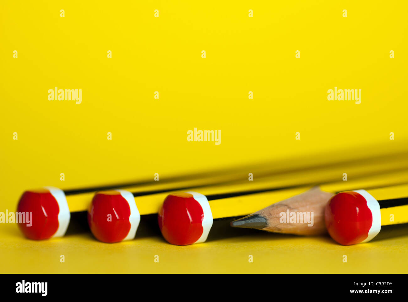 Pencils arranged so that one is the 'odd one out' Stock Photo - Alamy