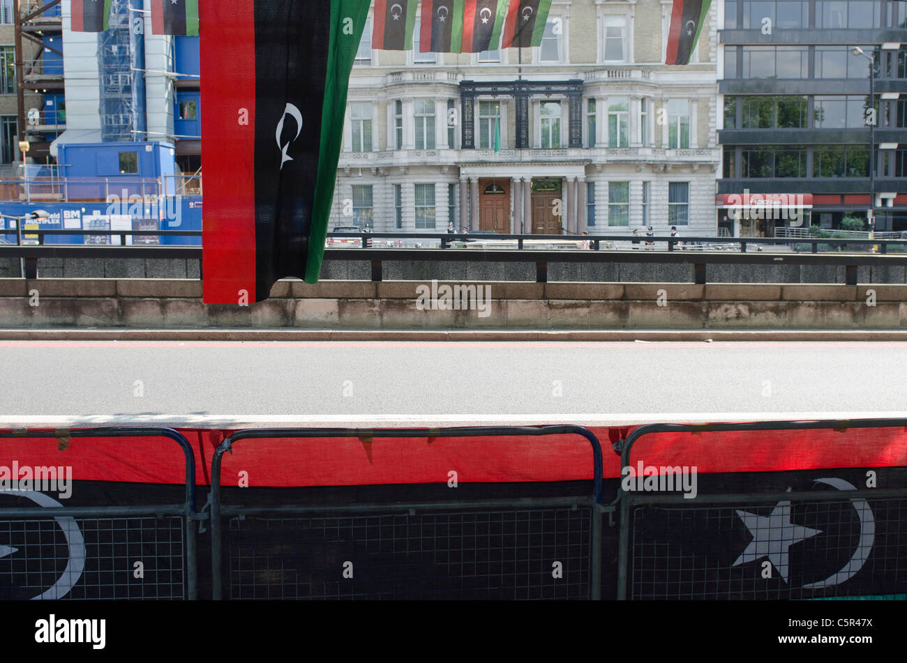 Libyan Rebel flag in foreground and Libyan embassy London behind Stock ...