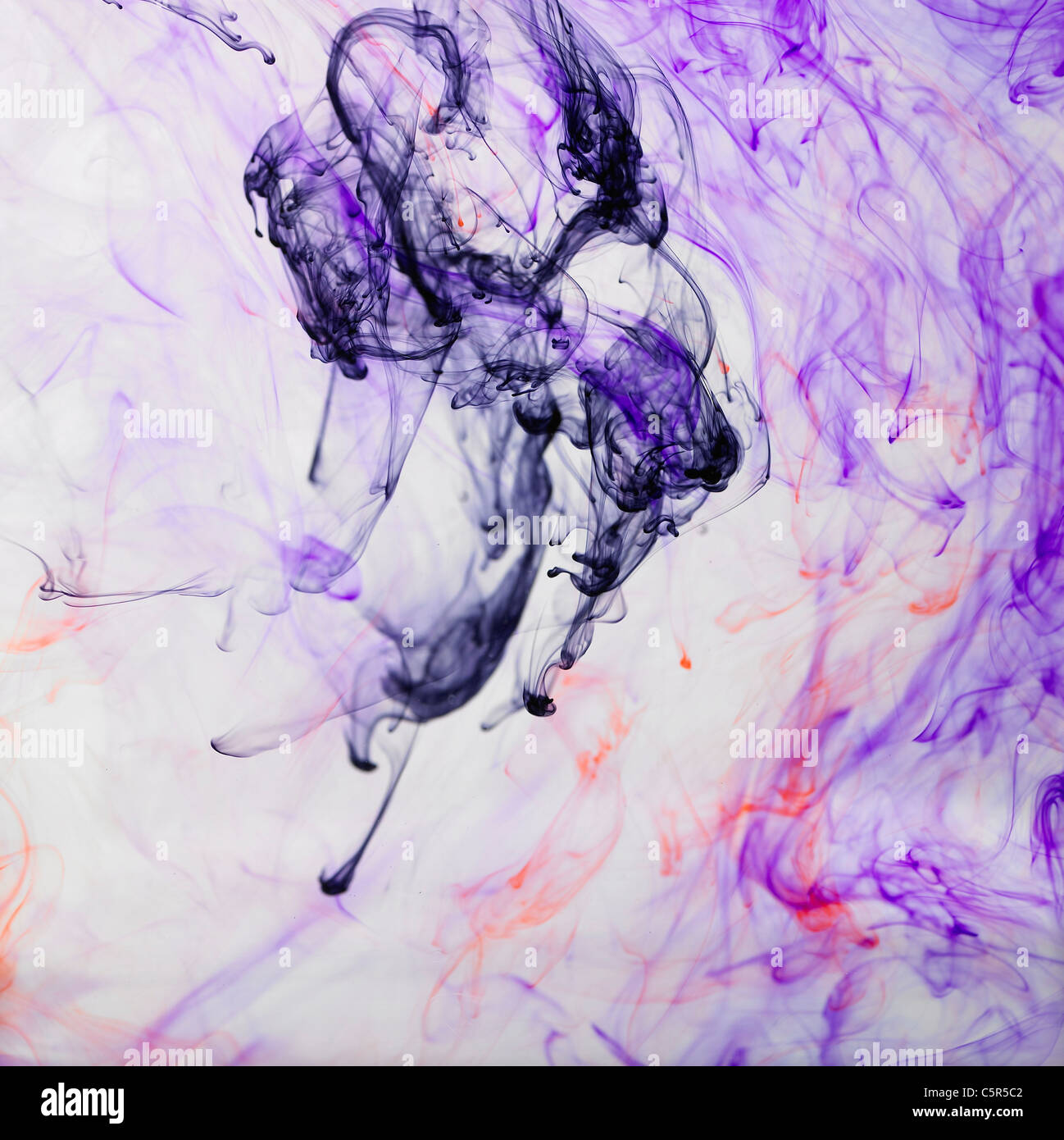 Various colors of ink dissolving in water Stock Photo - Alamy