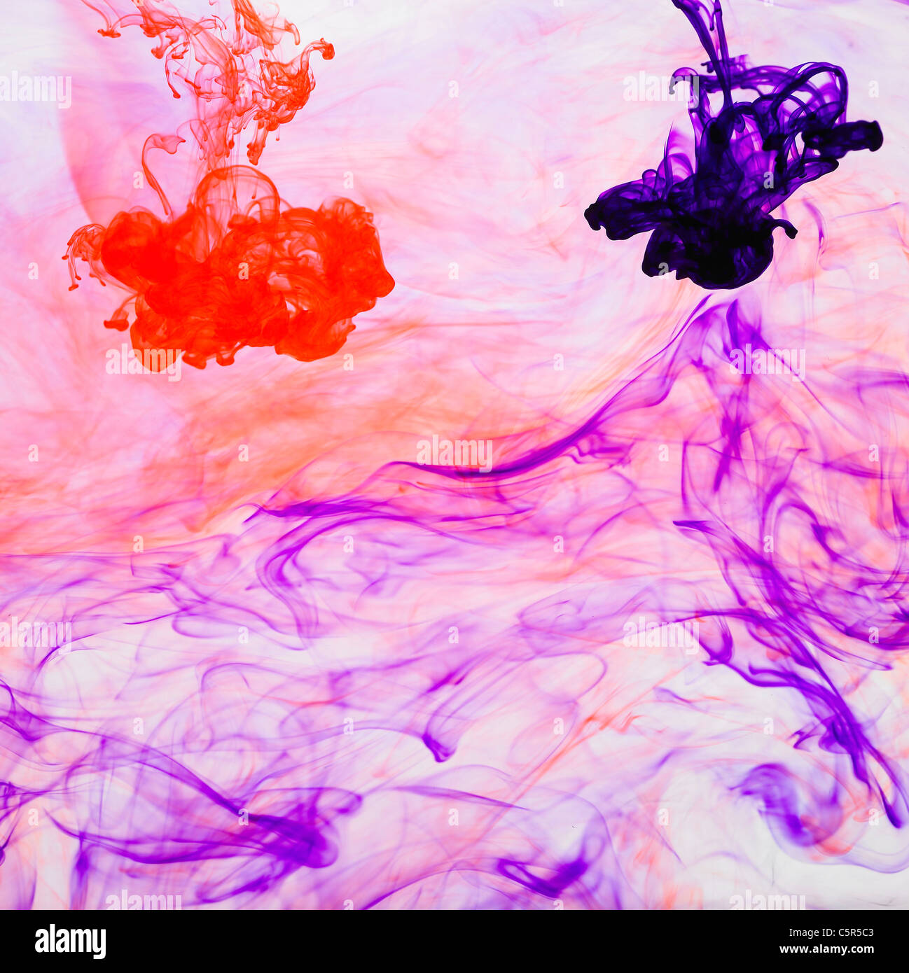 Various colors of ink dissolving in water Stock Photo - Alamy
