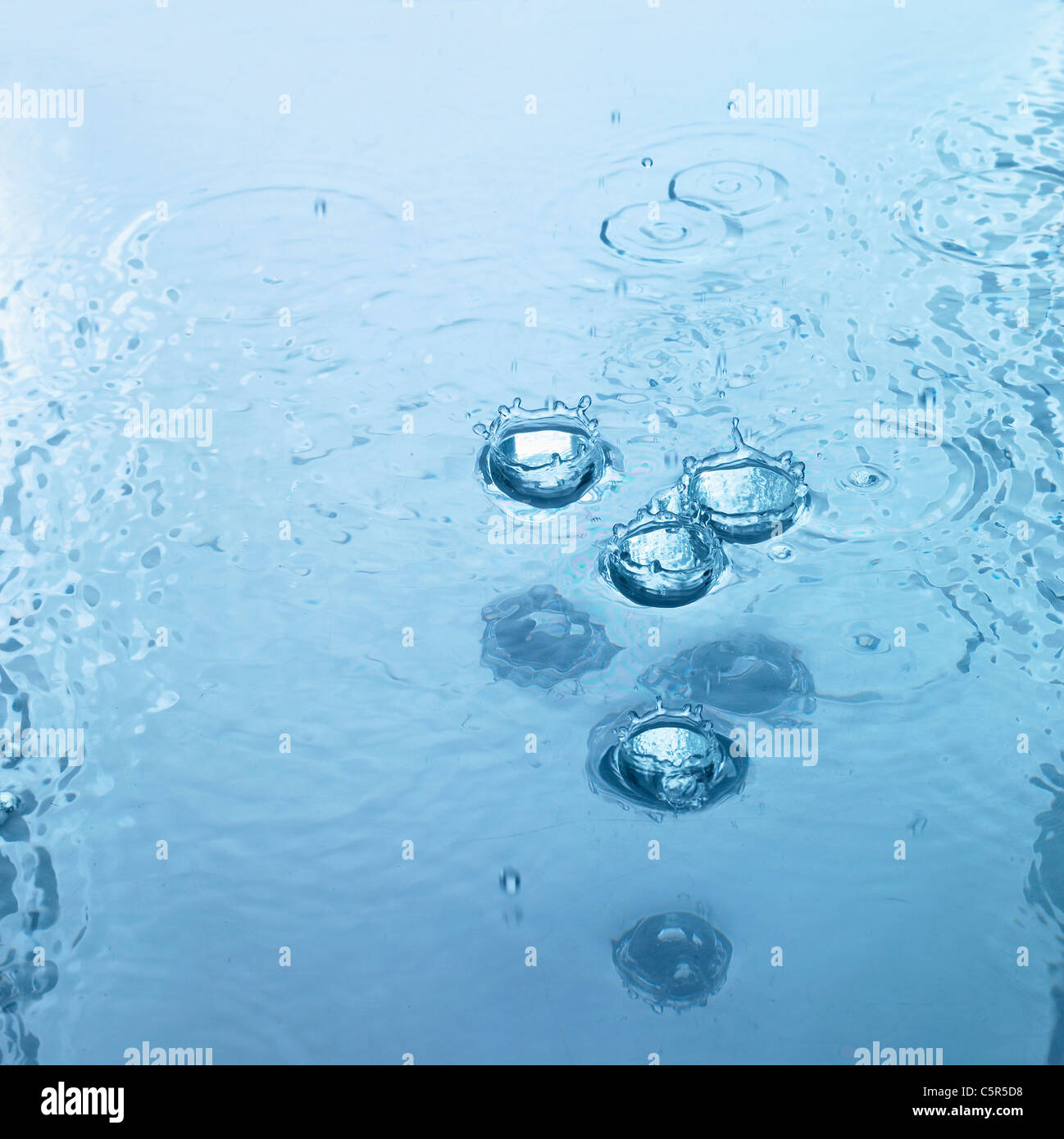 Dripping into water surface hi-res stock photography and images - Alamy