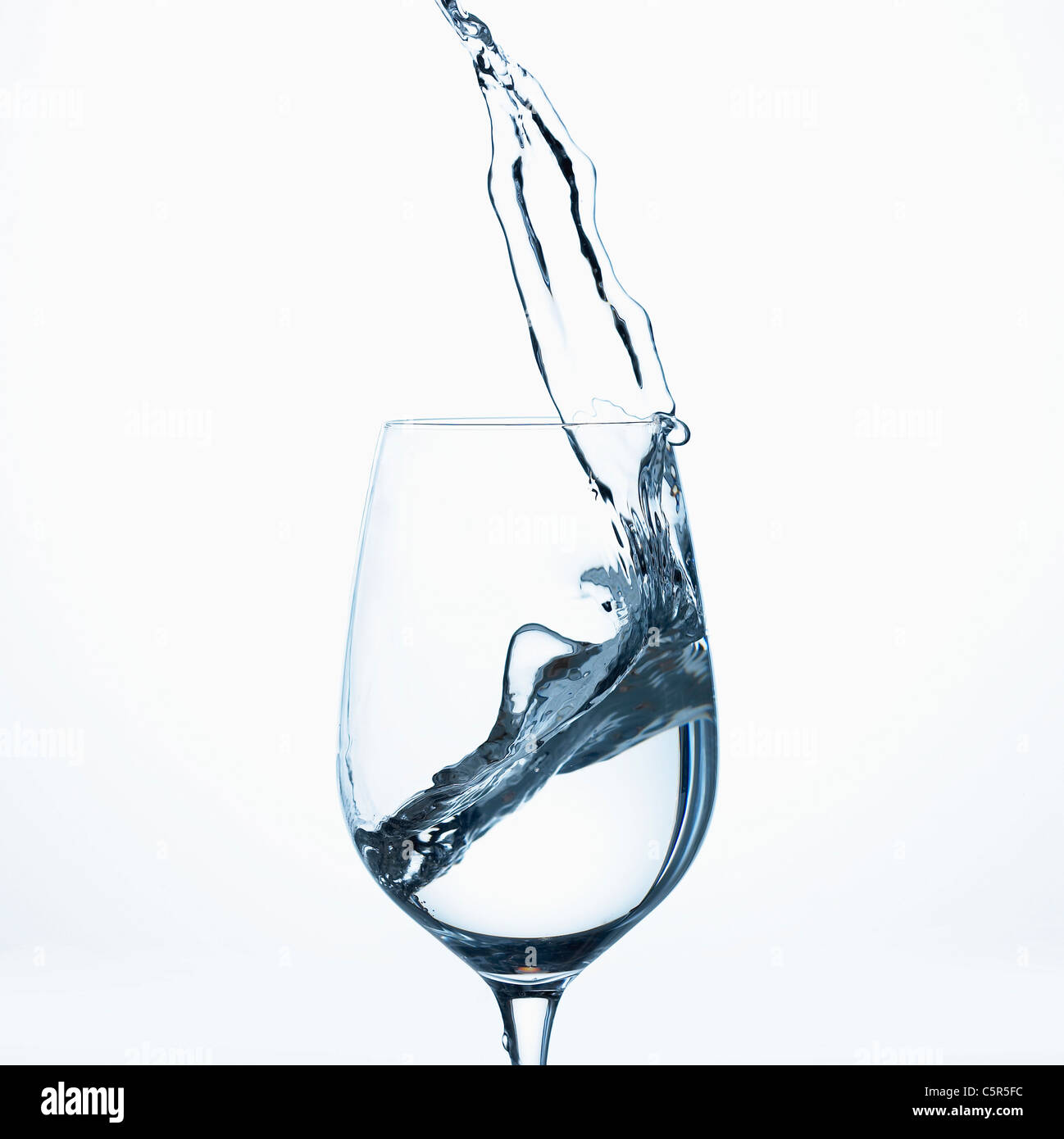 Water pouring into a glass Stock Photo - Alamy
