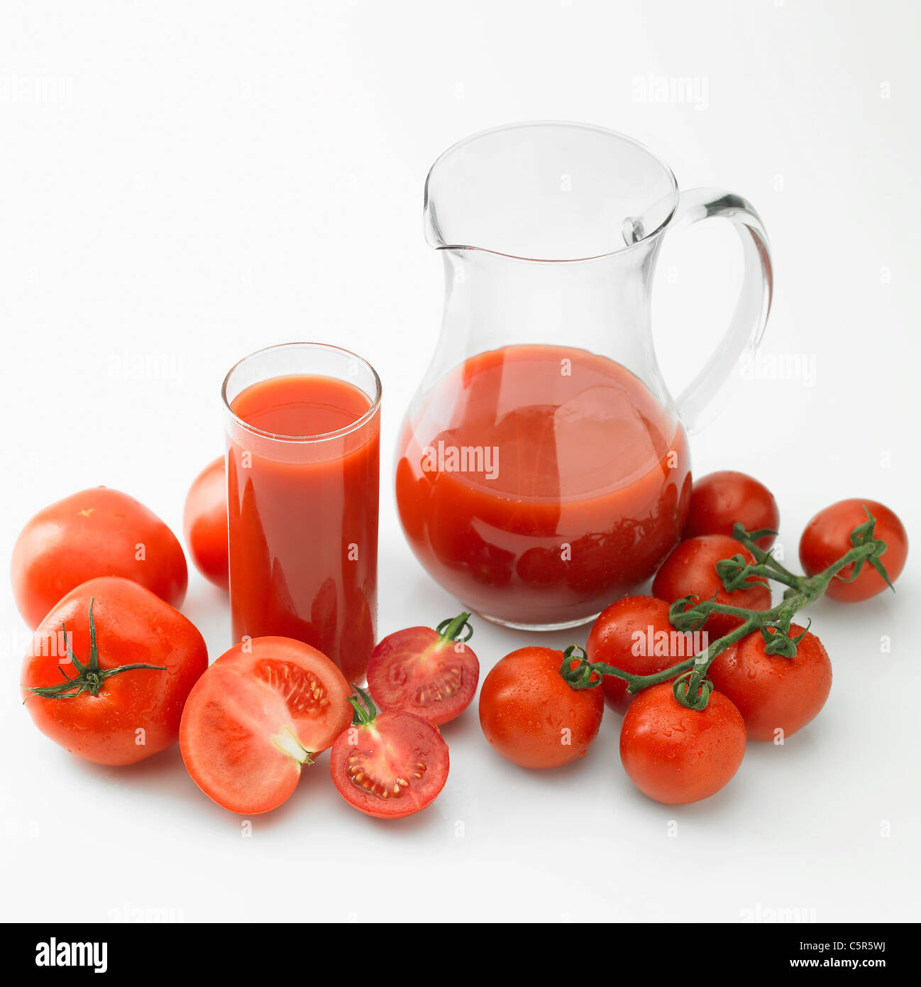 Tomatoes, cherry tomatoes and tomato juice Stock Photo - Alamy