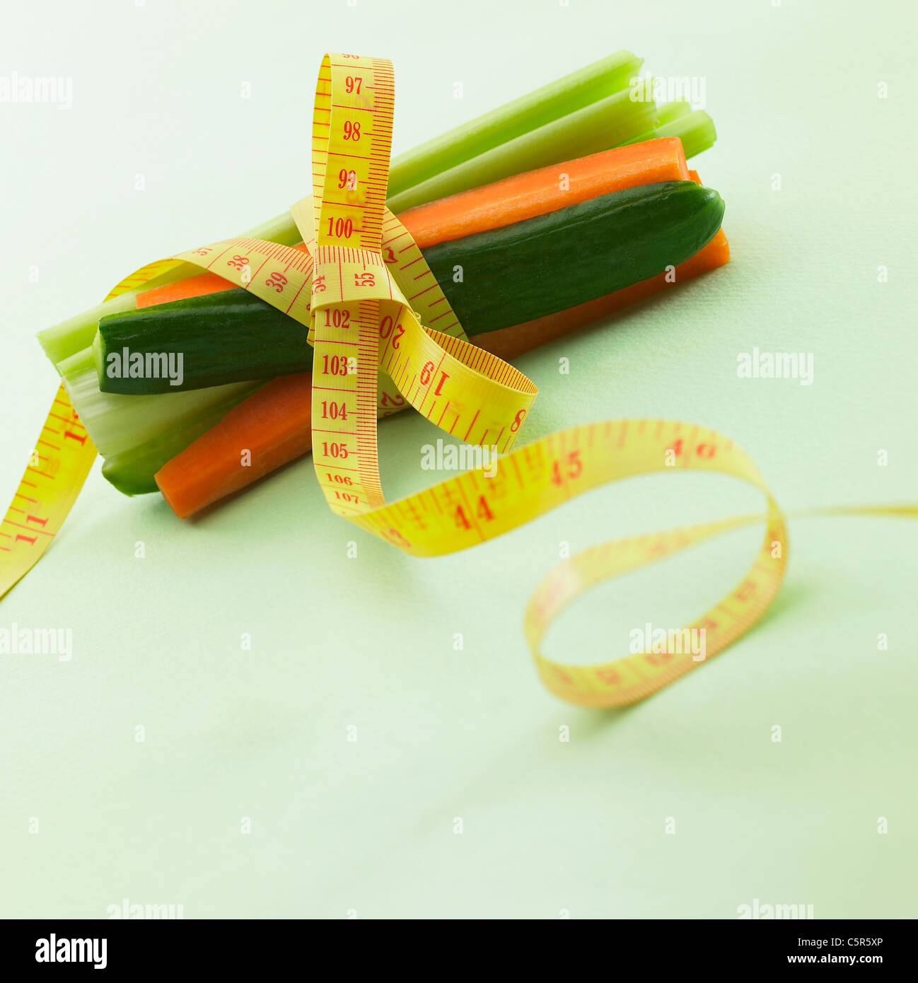 A measuring tape around vegetables Stock Photo - Alamy