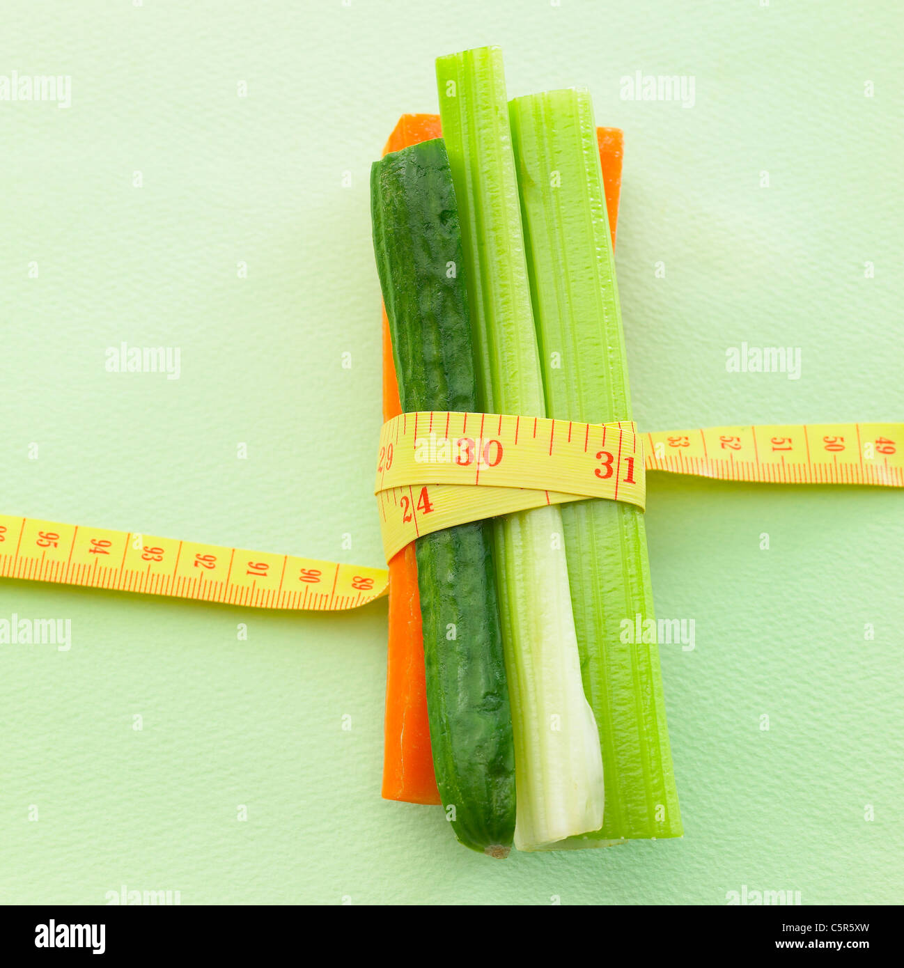A measuring tape around vegetables Stock Photo - Alamy
