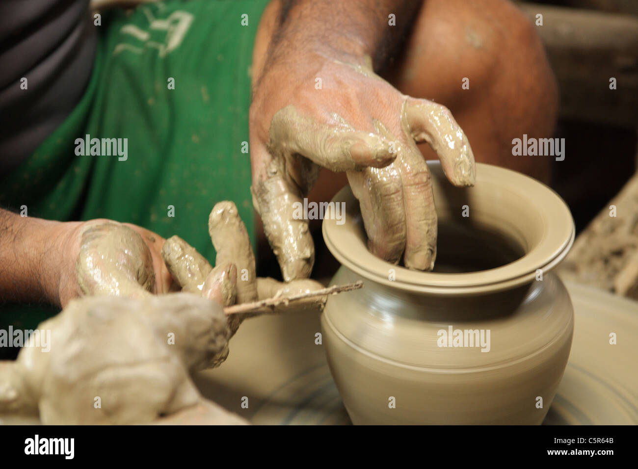 Hands throwing pot on pottery wheel Stock Photo - Alamy