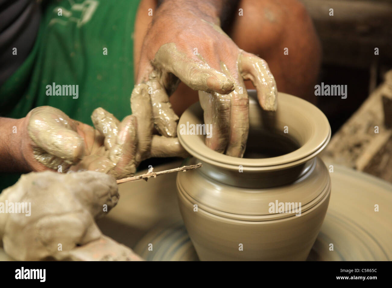 Hands throwing pot on pottery wheel Stock Photo - Alamy