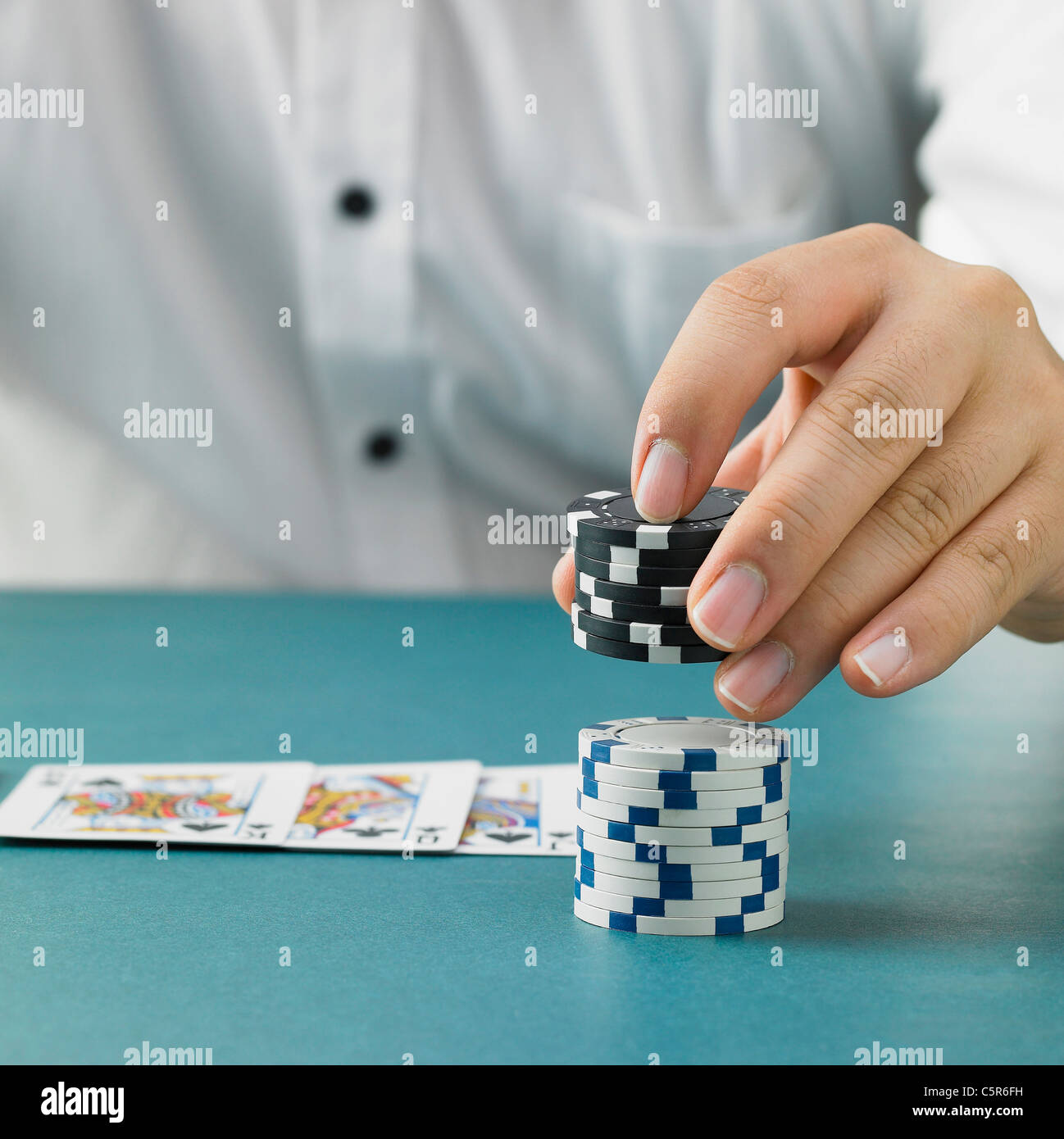 A person playing cards Stock Photo - Alamy