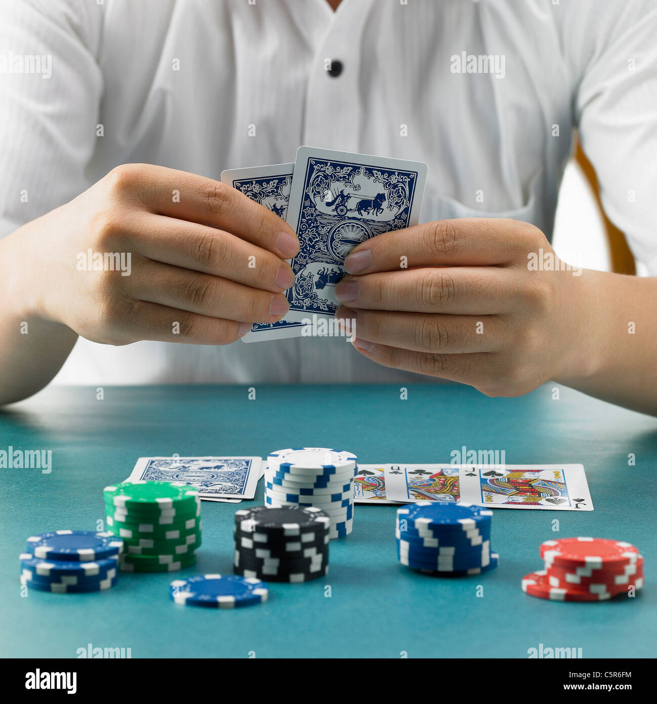 A person playing cards Stock Photo - Alamy