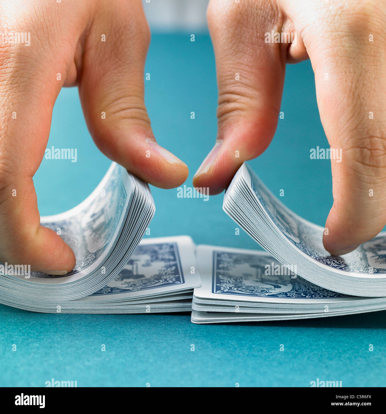 A person shuffling cards Stock Photo - Alamy