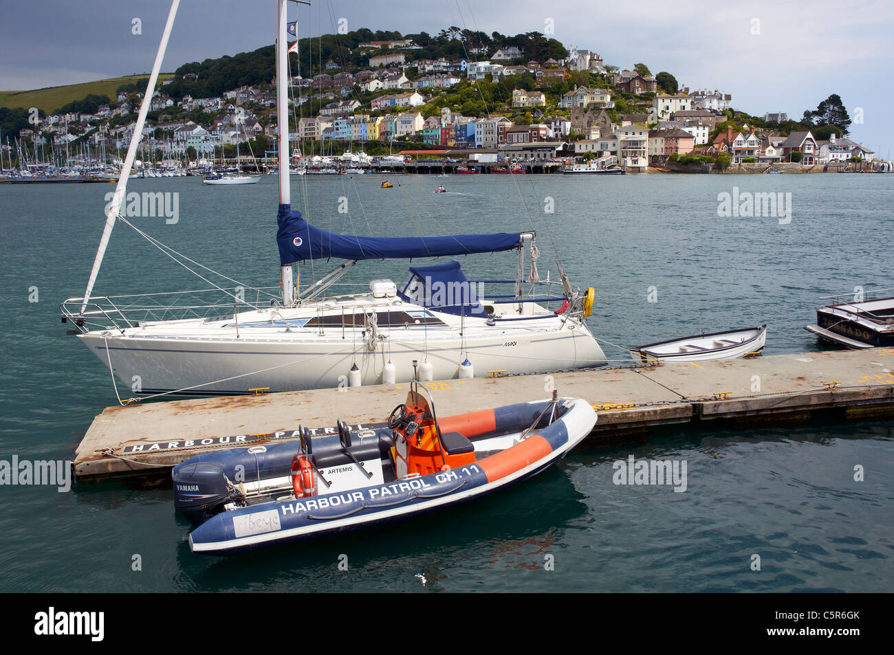 Mooring pontoon with sailing yacht and harbour patrol RIB at Dartmouth ...