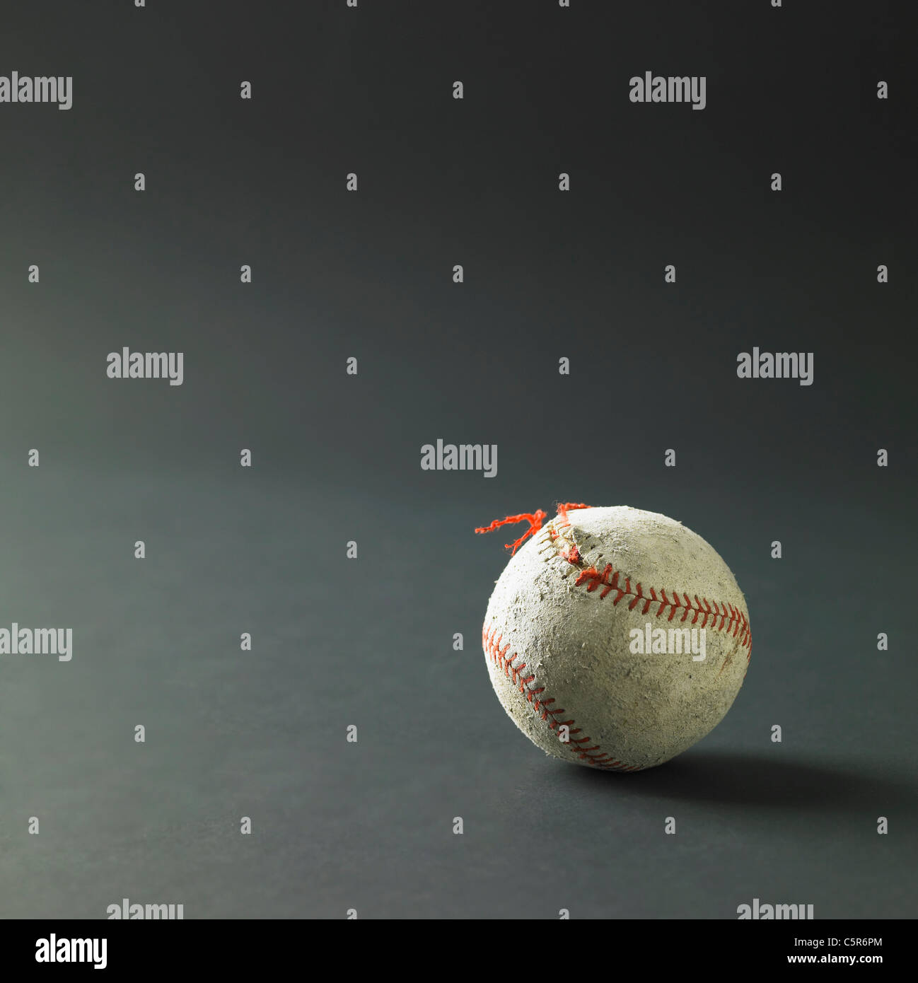 Side-view of an old baseball with its stitch ripped Stock Photo - Alamy