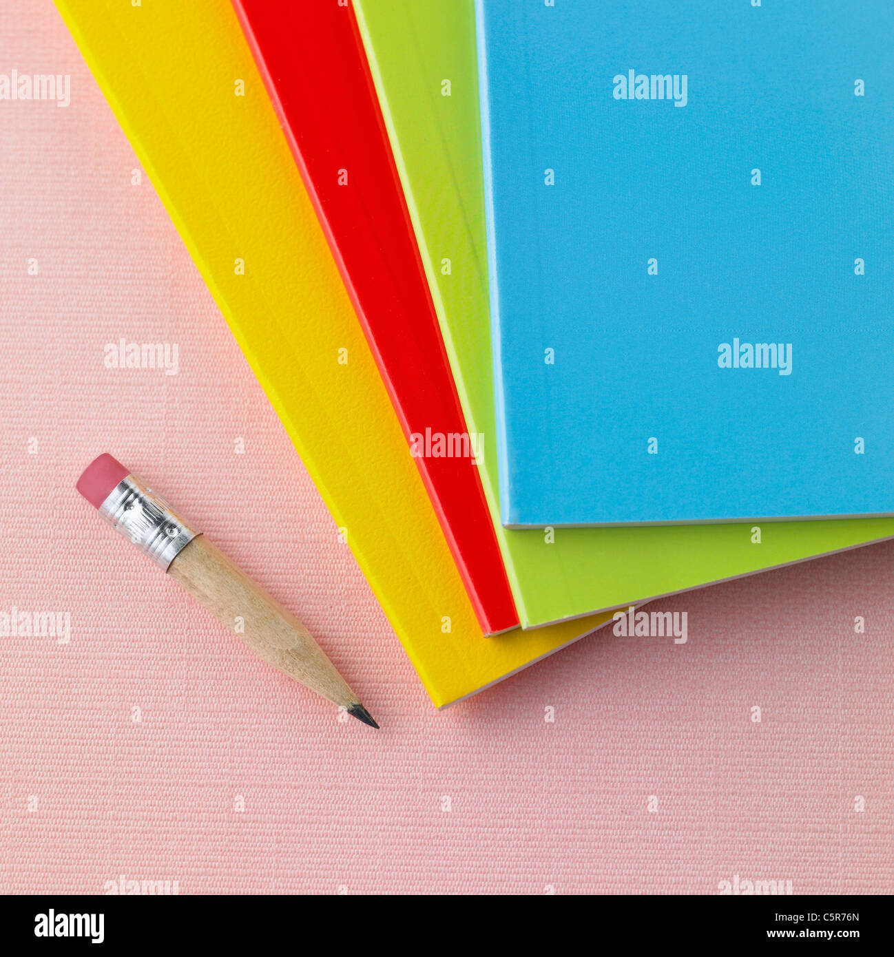 Notebooks and a pencil Stock Photo - Alamy