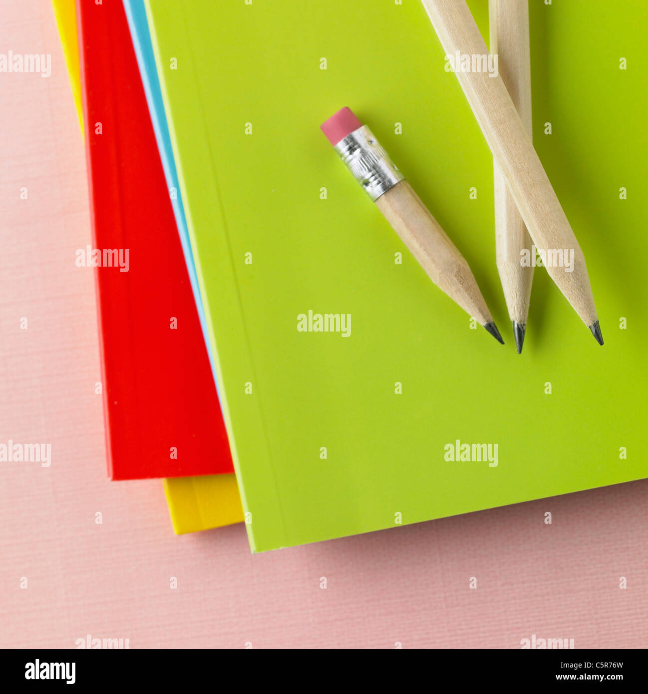 Notebooks and pencils Stock Photo - Alamy