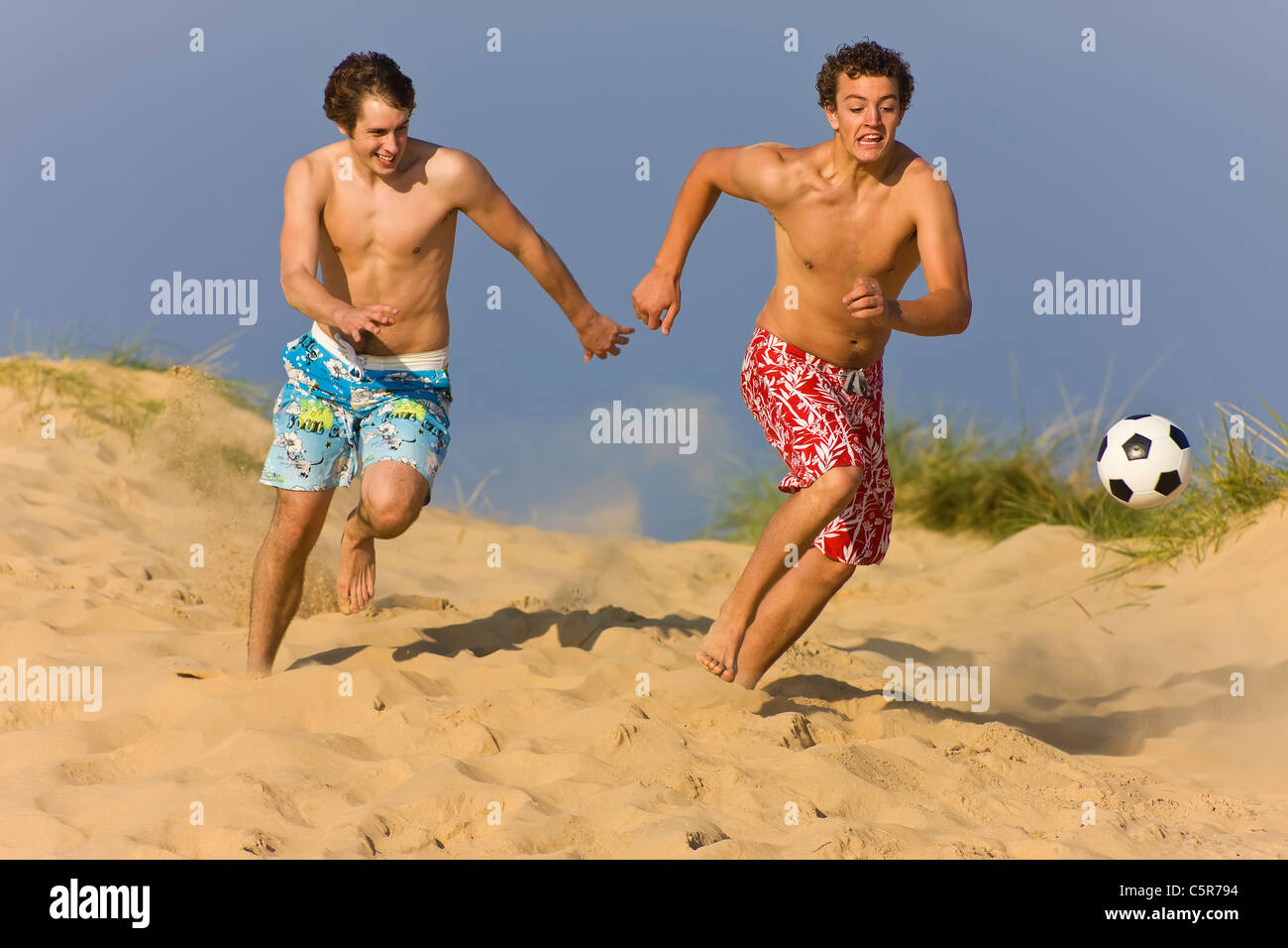 Two players chasing the ball hi-res stock photography and images - Alamy