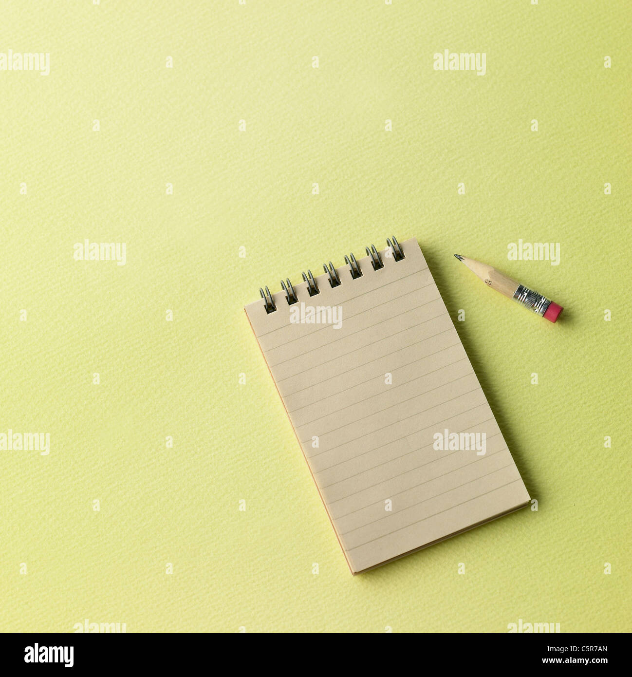 A notebook and a pencil Stock Photo - Alamy