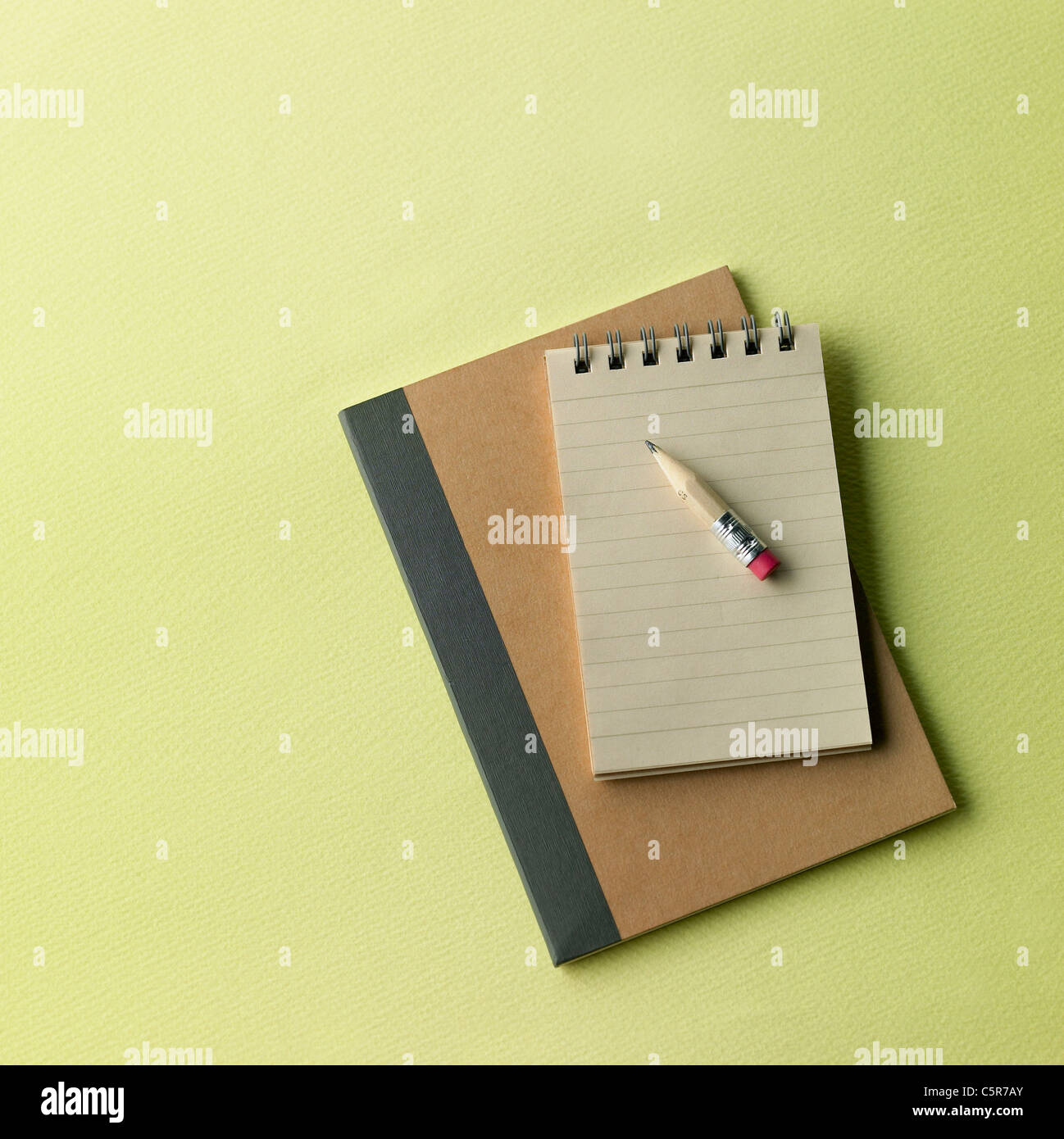 Notebooks and a pencil Stock Photo - Alamy
