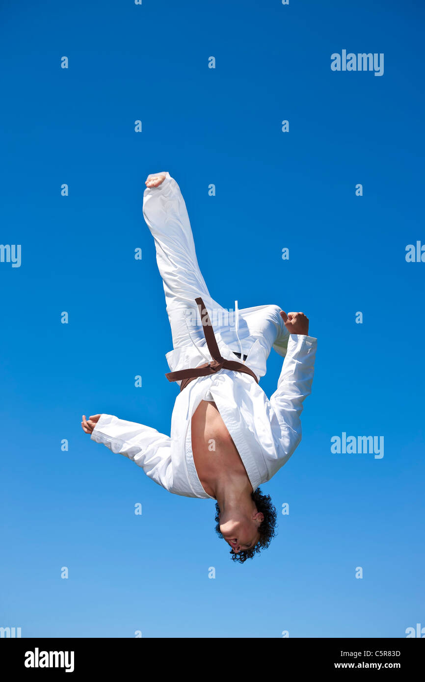 A Martial artist does a huge backflip Stock Photo - Alamy