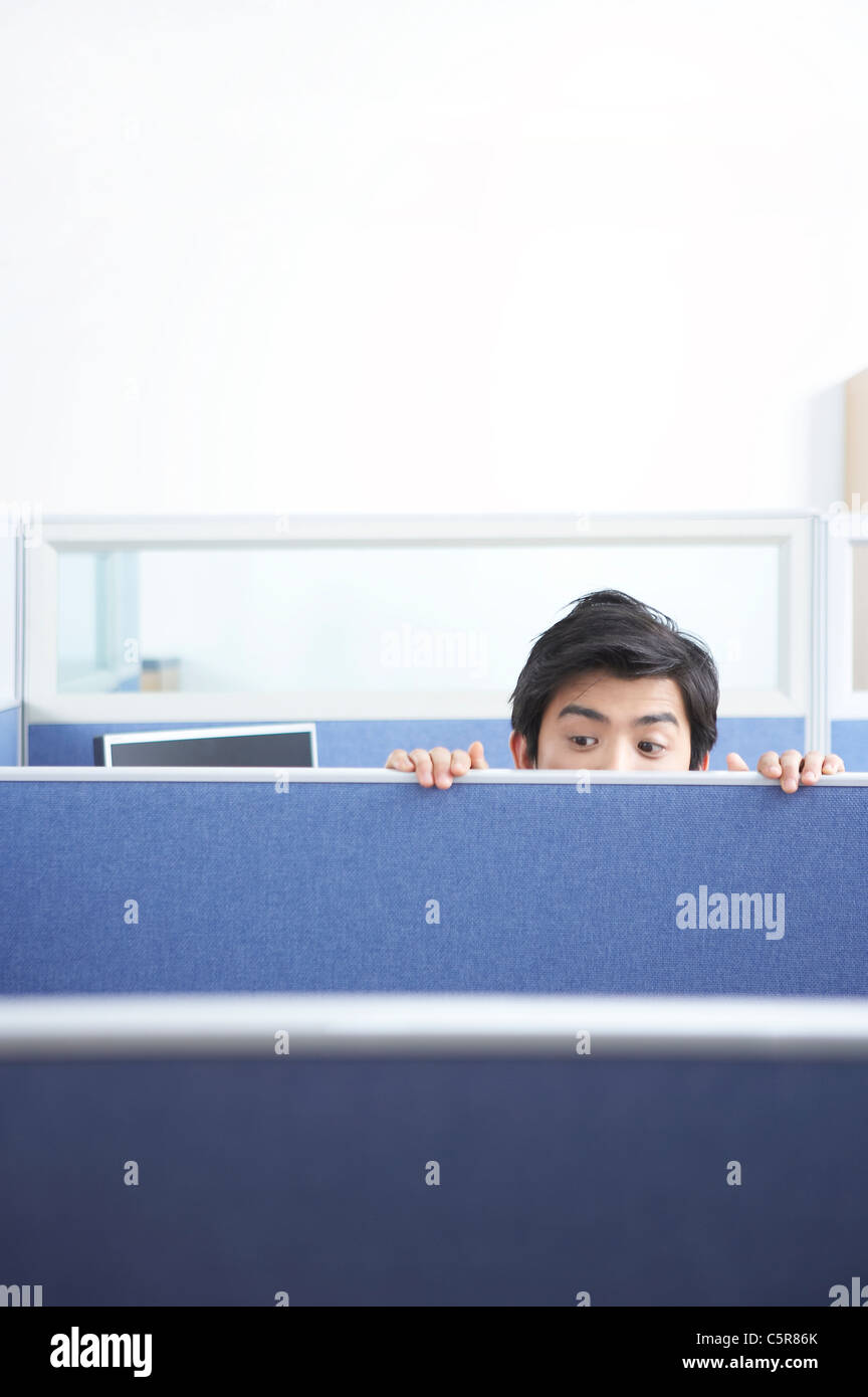 A man hiding by partition Stock Photo - Alamy