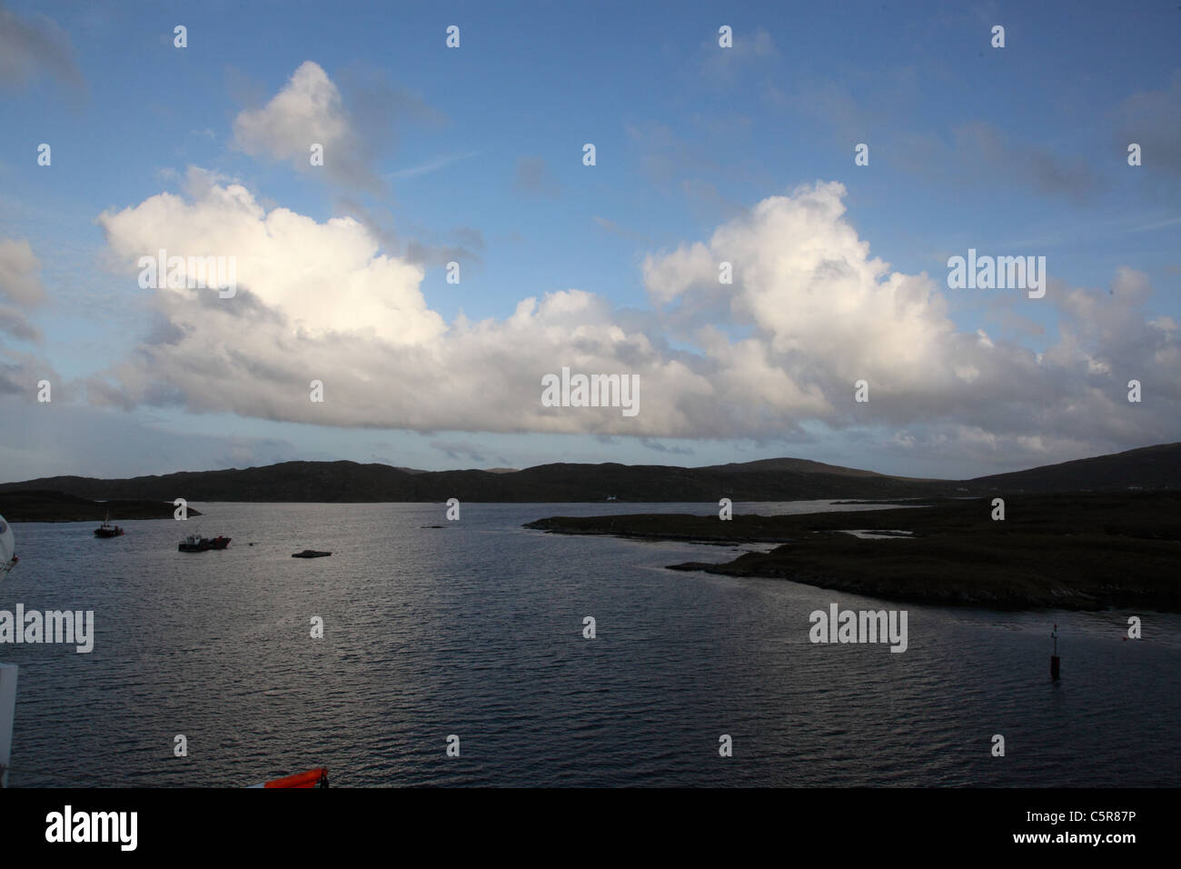 sunset over lochboisdale an important ferry connection in the Island of ...
