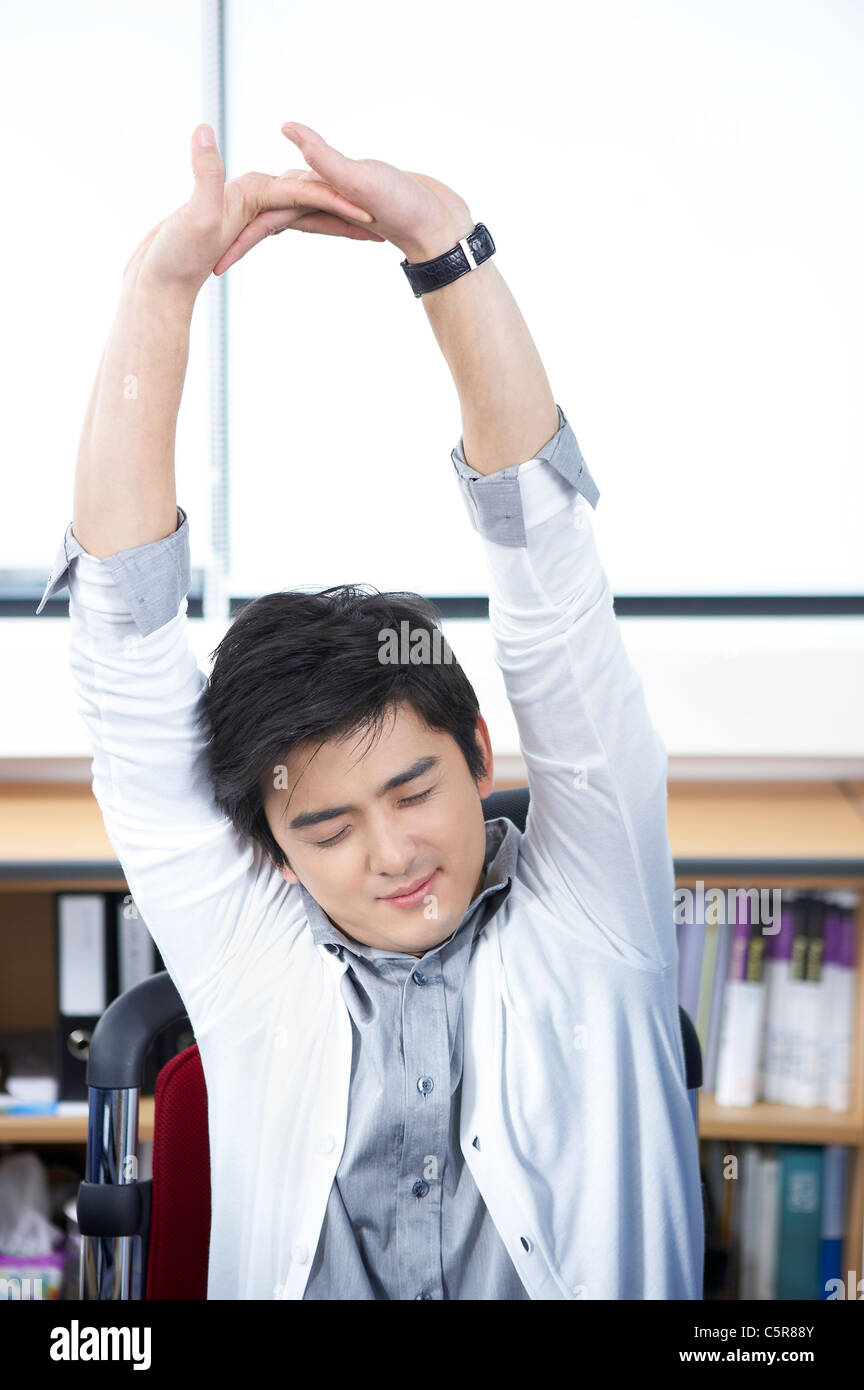 A business man stretching himself Stock Photo - Alamy