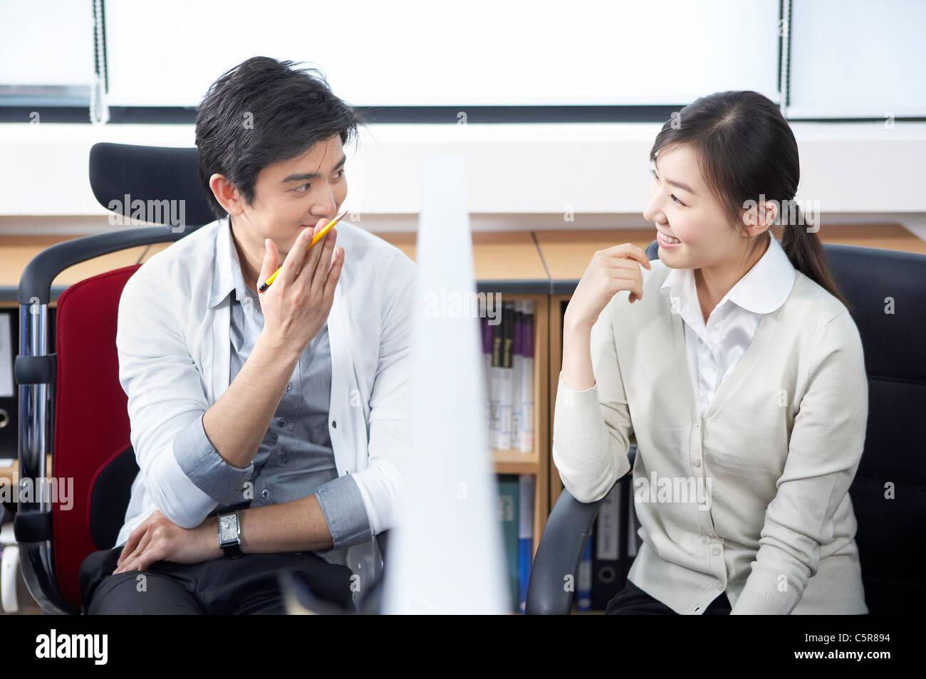 A business man and a business woman having a conversation Stock Photo ...