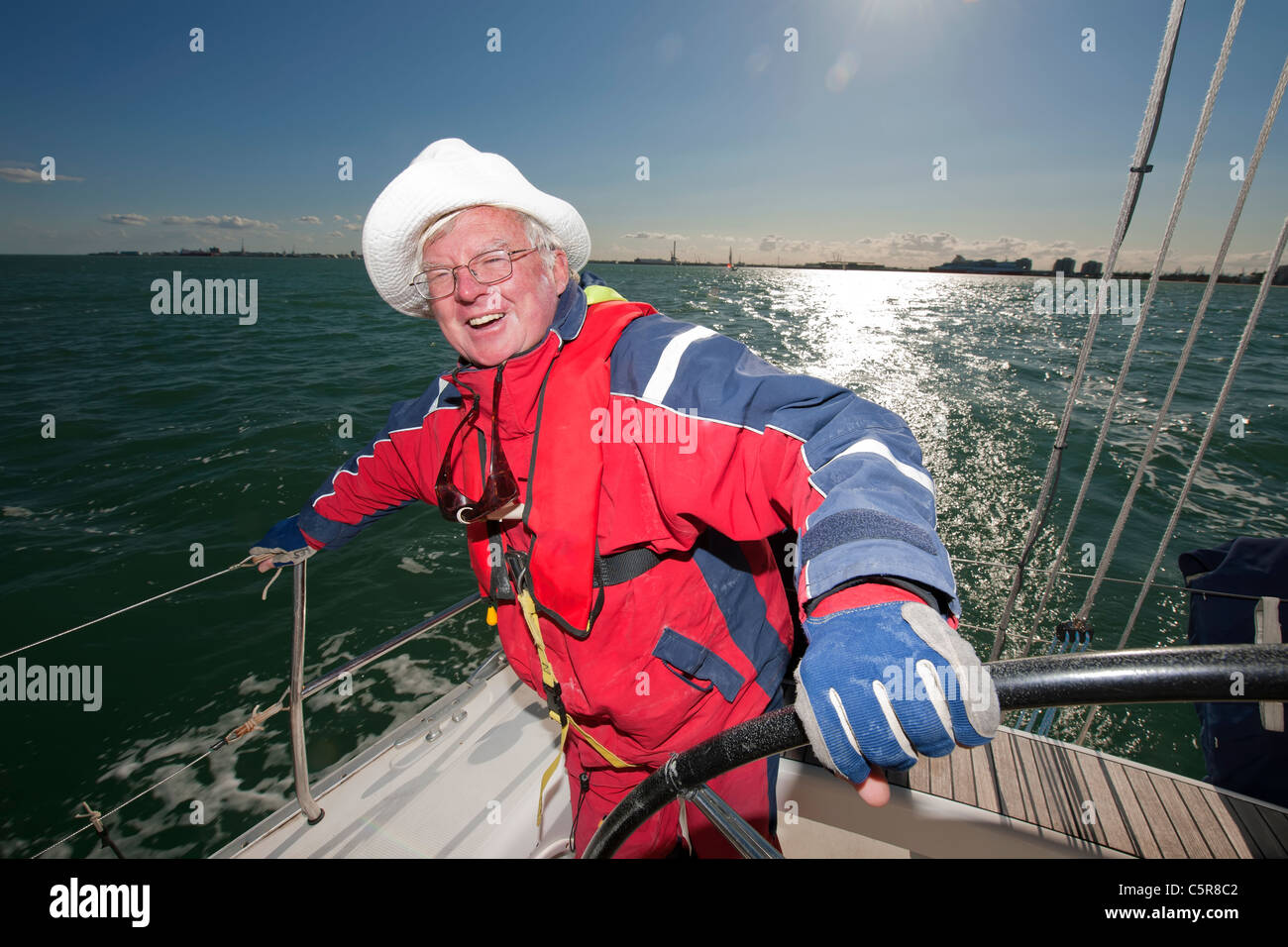 Captain of Ocean going yacht smiles Stock Photo - Alamy