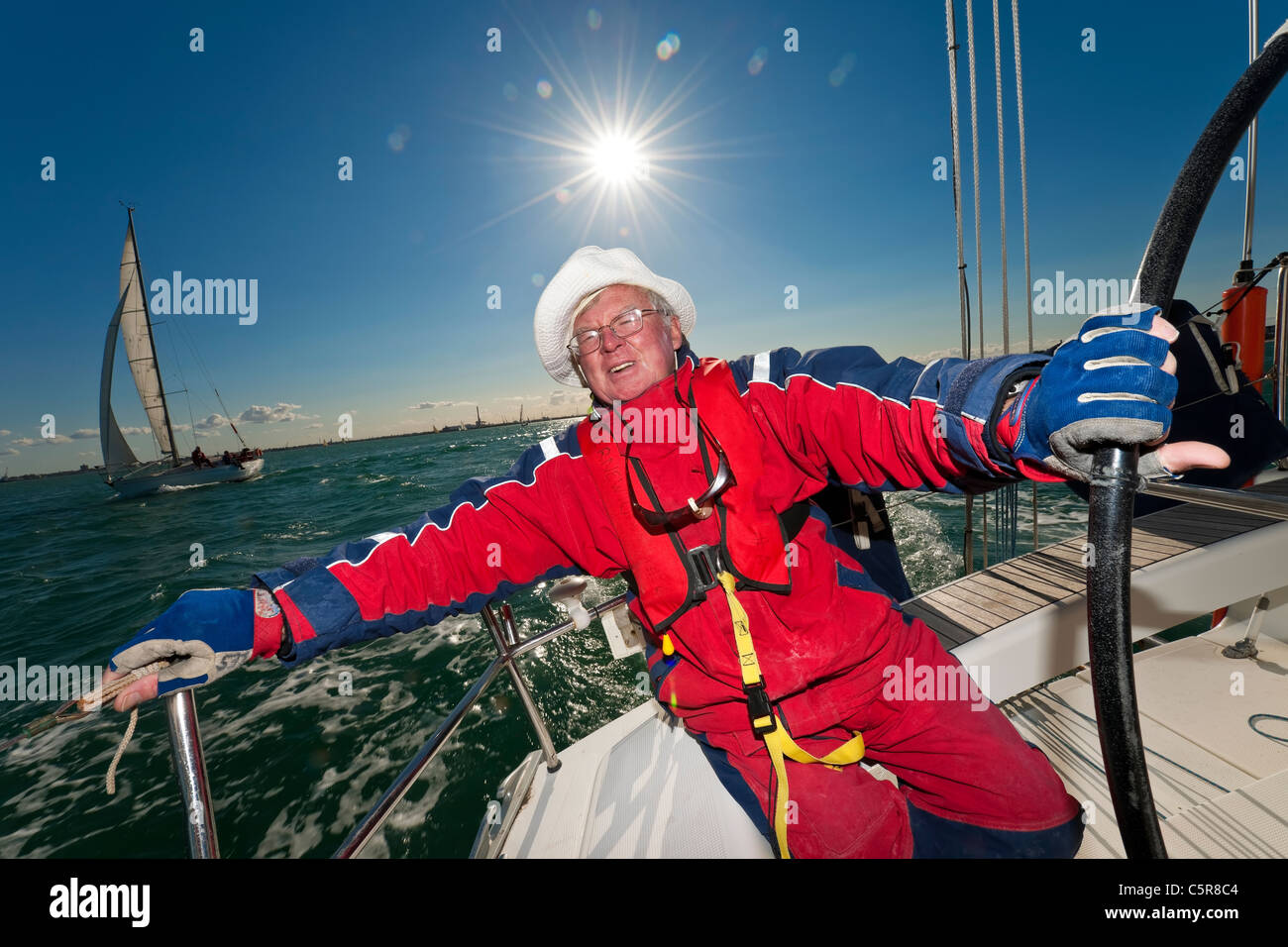 The captain at the wheel of an Ocean going yacht Stock Photo - Alamy
