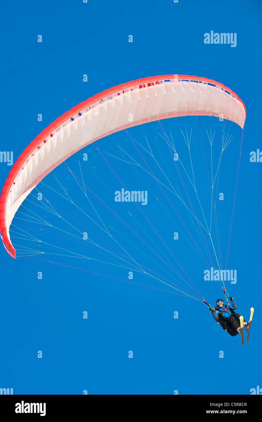 A Paraglider pilot connected to her wing by the lines Stock Photo - Alamy