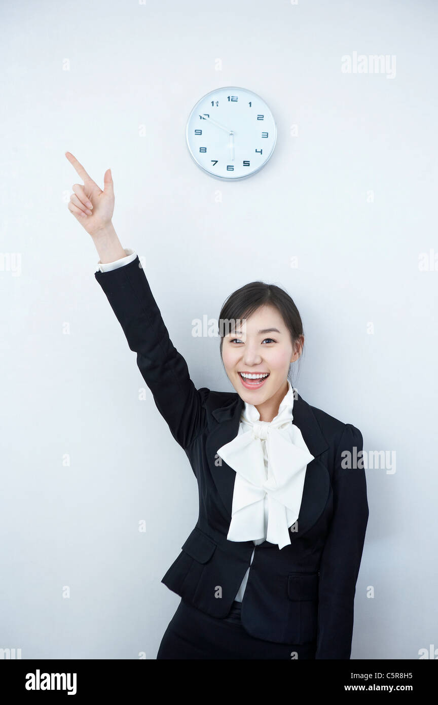 A business woman pointing up Stock Photo - Alamy