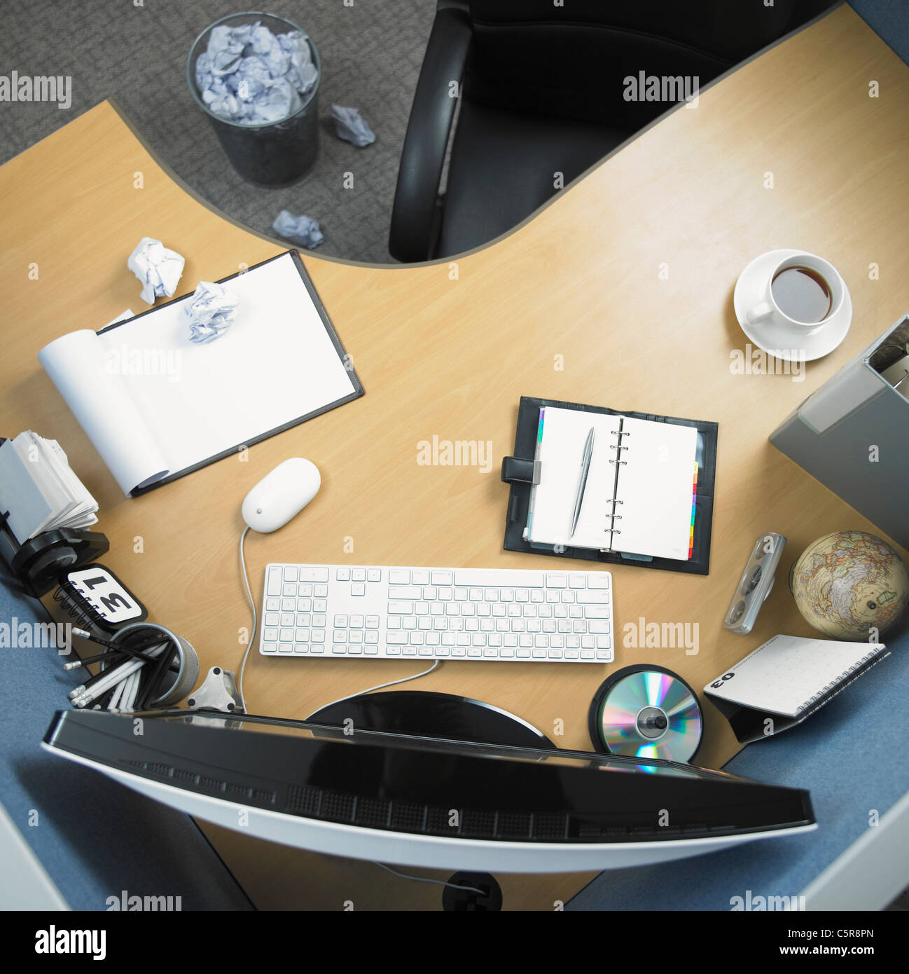 Office table with paper wastes Stock Photo - Alamy