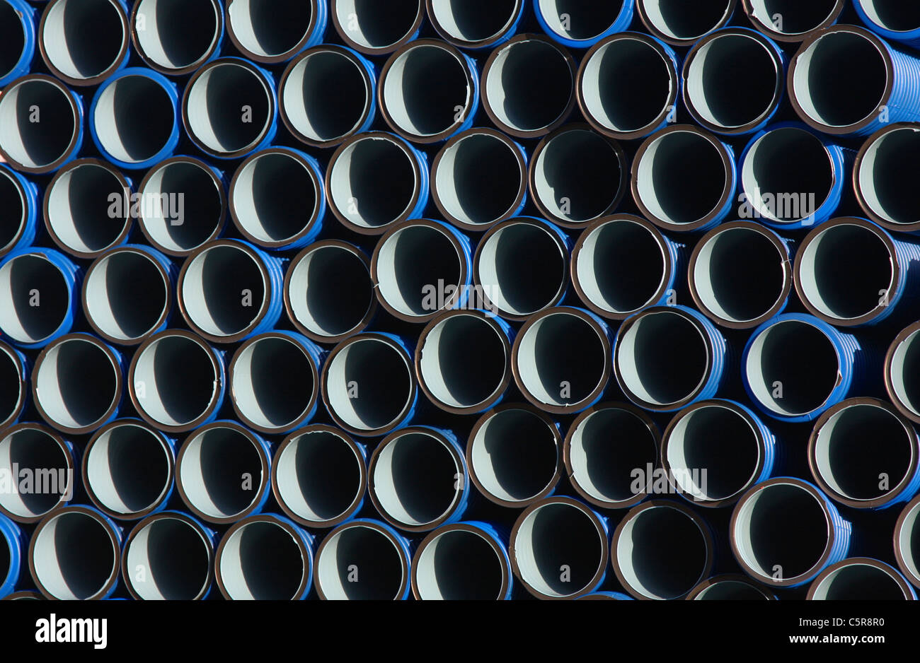 Stacked tubes viewed from an angle Stock Photo - Alamy