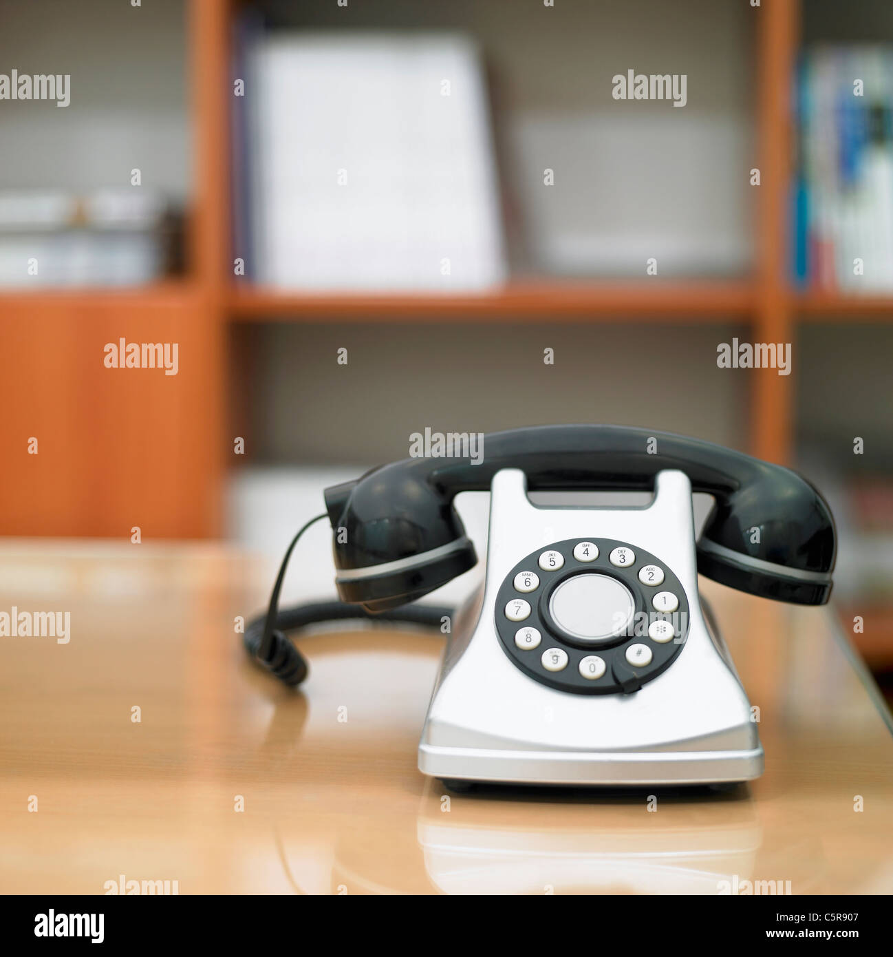 A telephone on a desk Stock Photo - Alamy