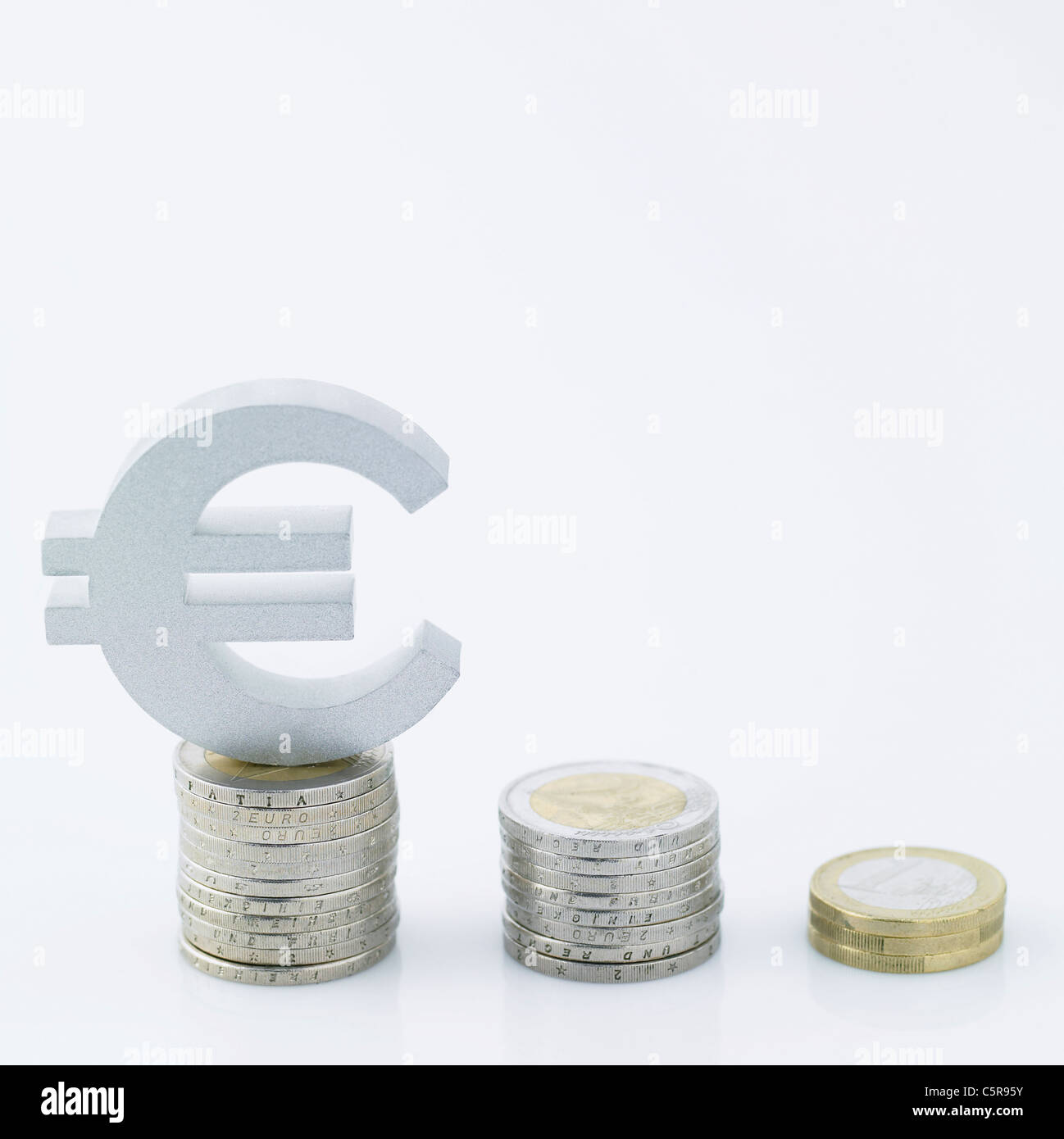 Currency sign and coins Stock Photo - Alamy
