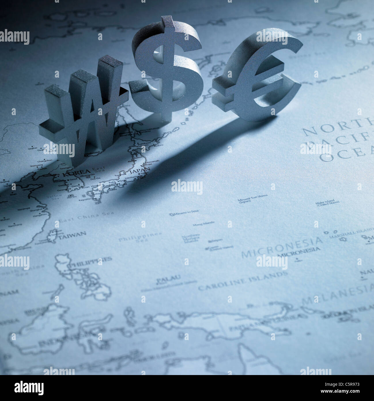 Currency signs on a map Stock Photo - Alamy