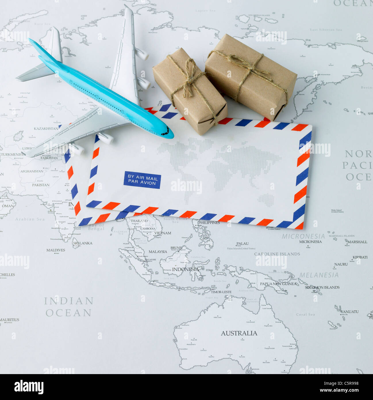 A toy airplane, packages, envelopes on a map Stock Photo - Alamy