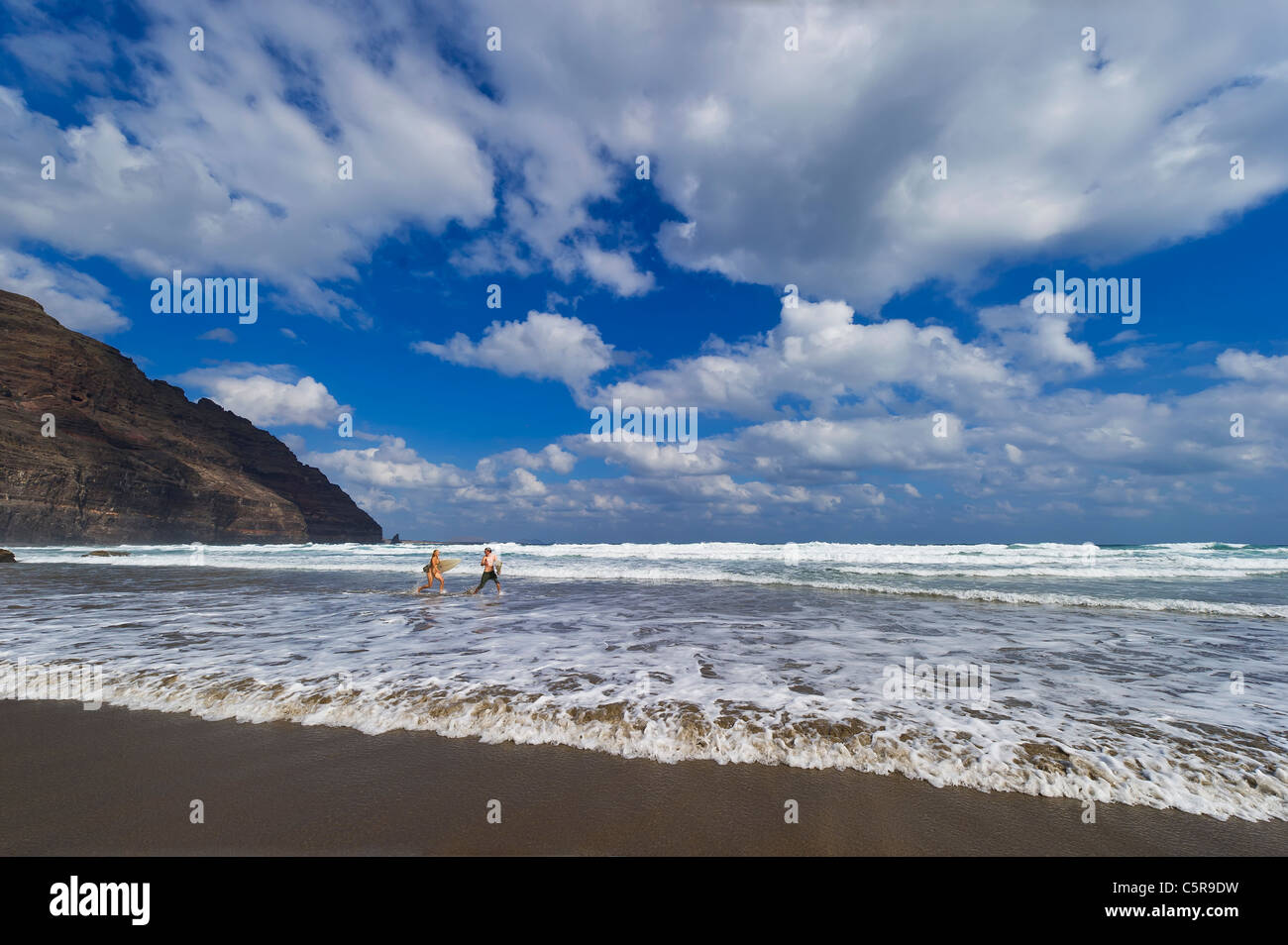 Surfers having fun in the ocean Stock Photo - Alamy