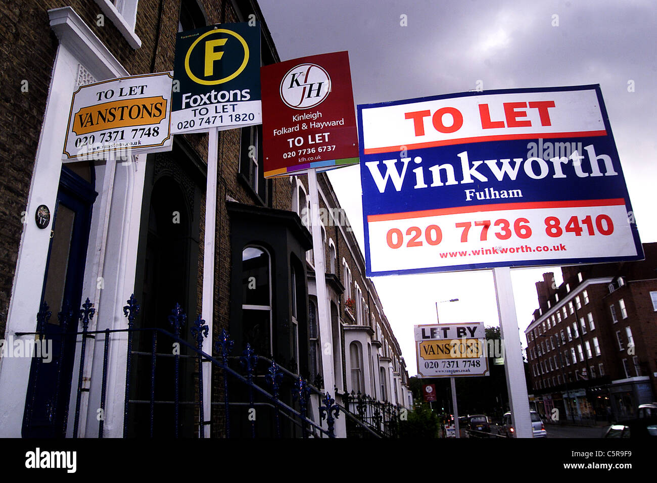 Various To Let boards on one street in Fulham, London Stock Photo - Alamy